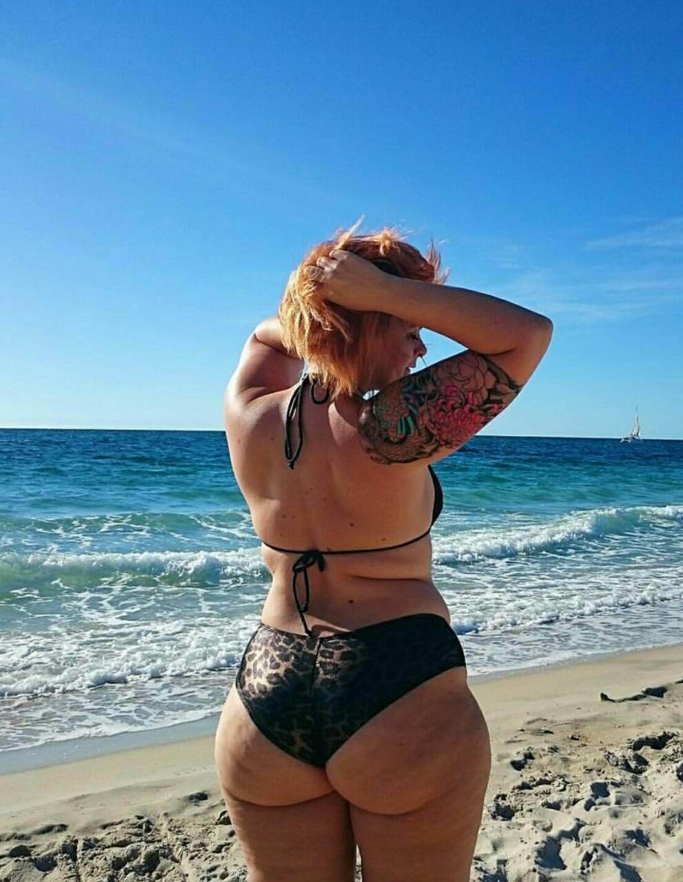 Nice tatted arm on a beach somewhere. | Scrolller