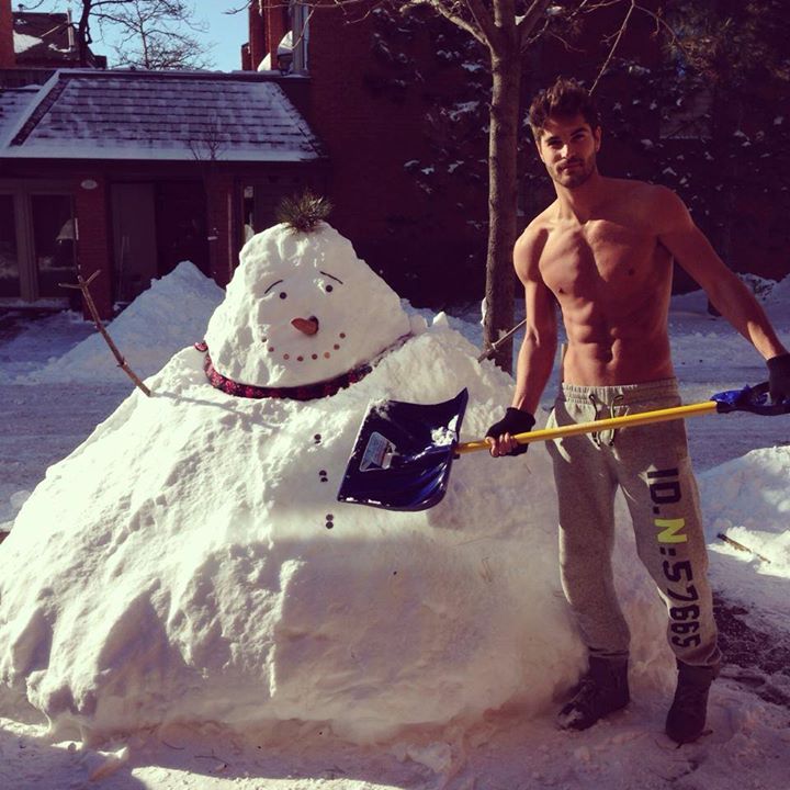 Nick Bateman building a snowman. | Scrolller