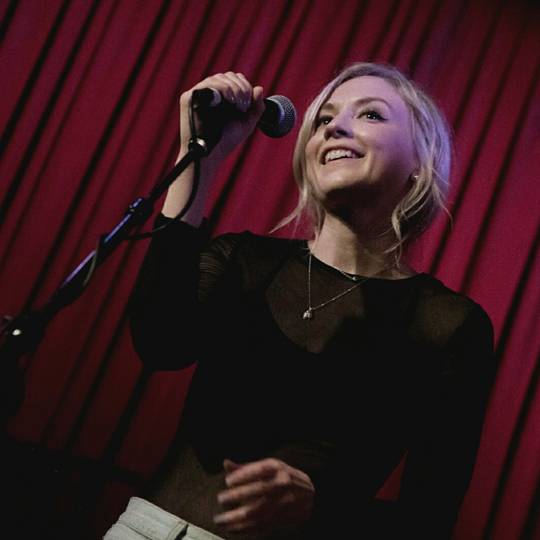 On stage. | Scrolller