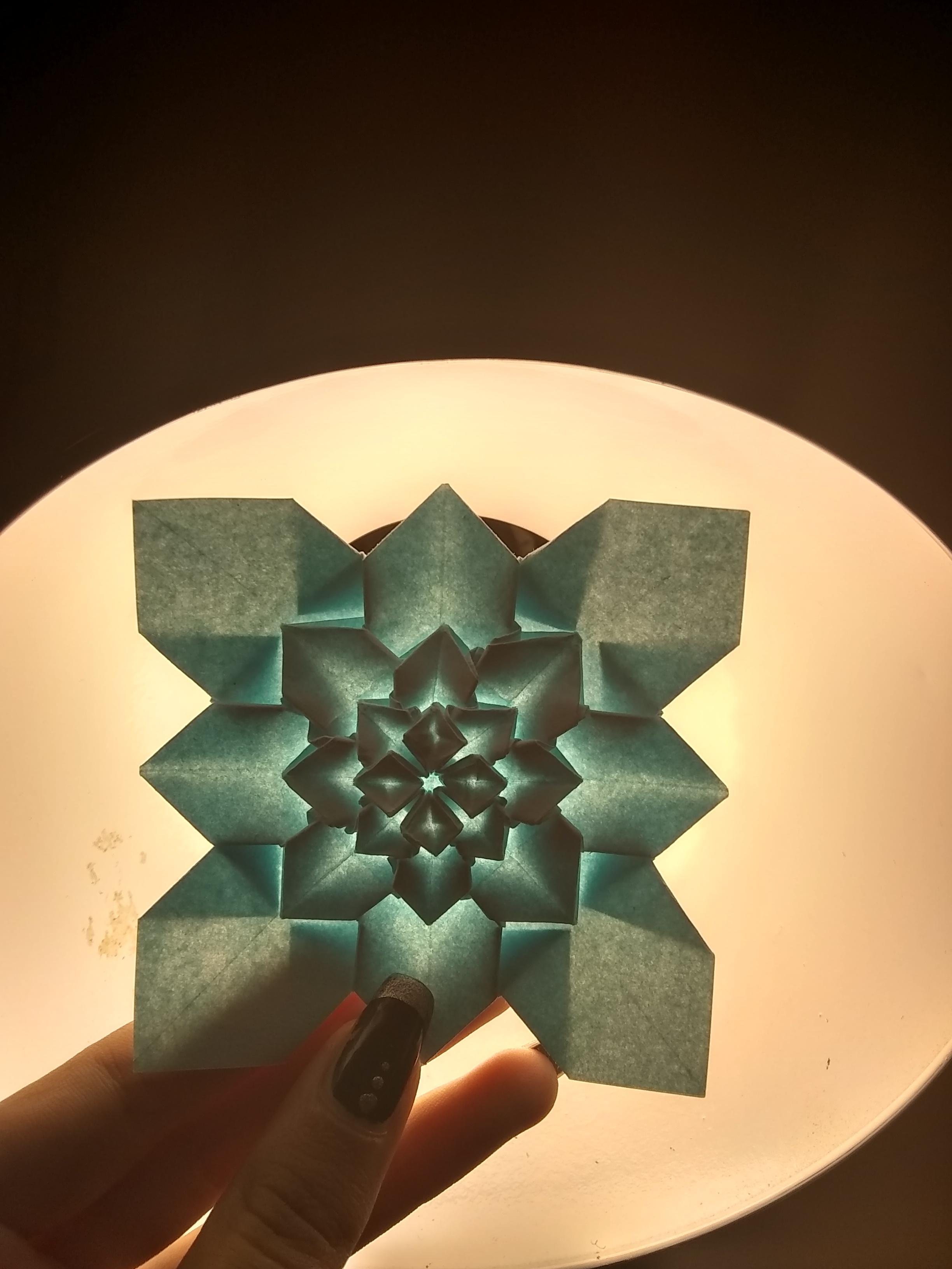 Origami flower under light | Scrolller