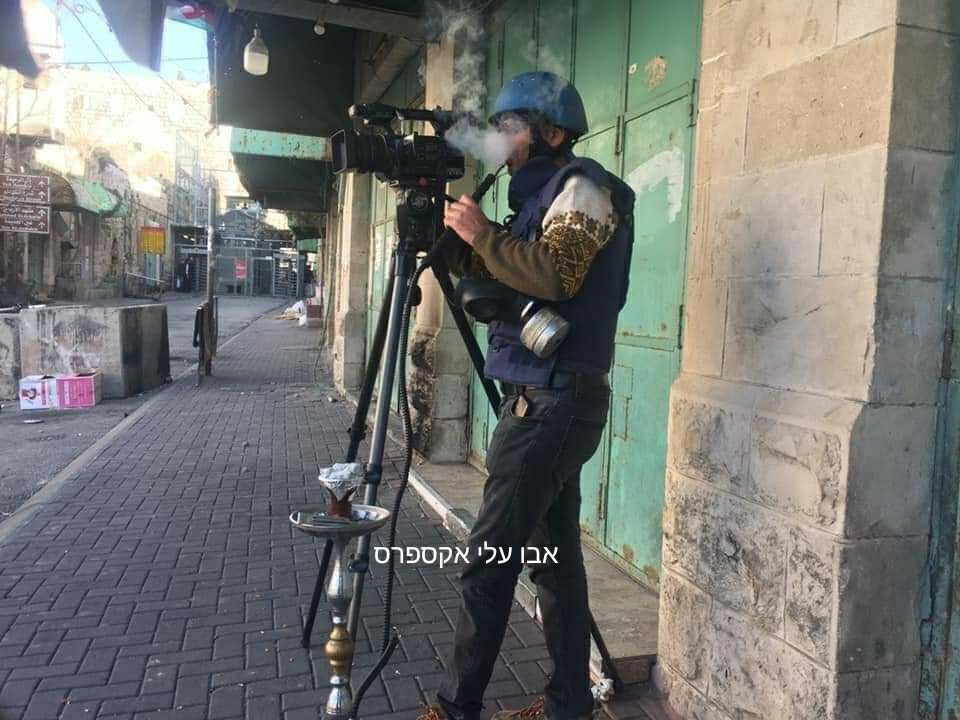 Palestinian reporter during the weekly friday riots. | Scrolller