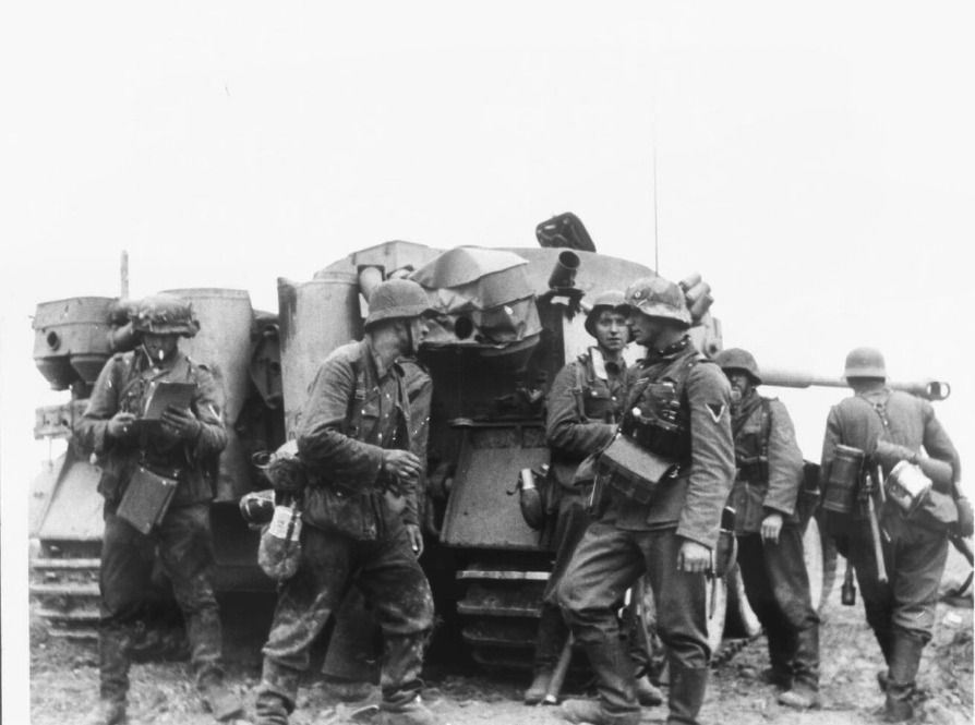 Panzergrenadiers stand by a Tiger somewhere on the Eastern Front | Scrolller