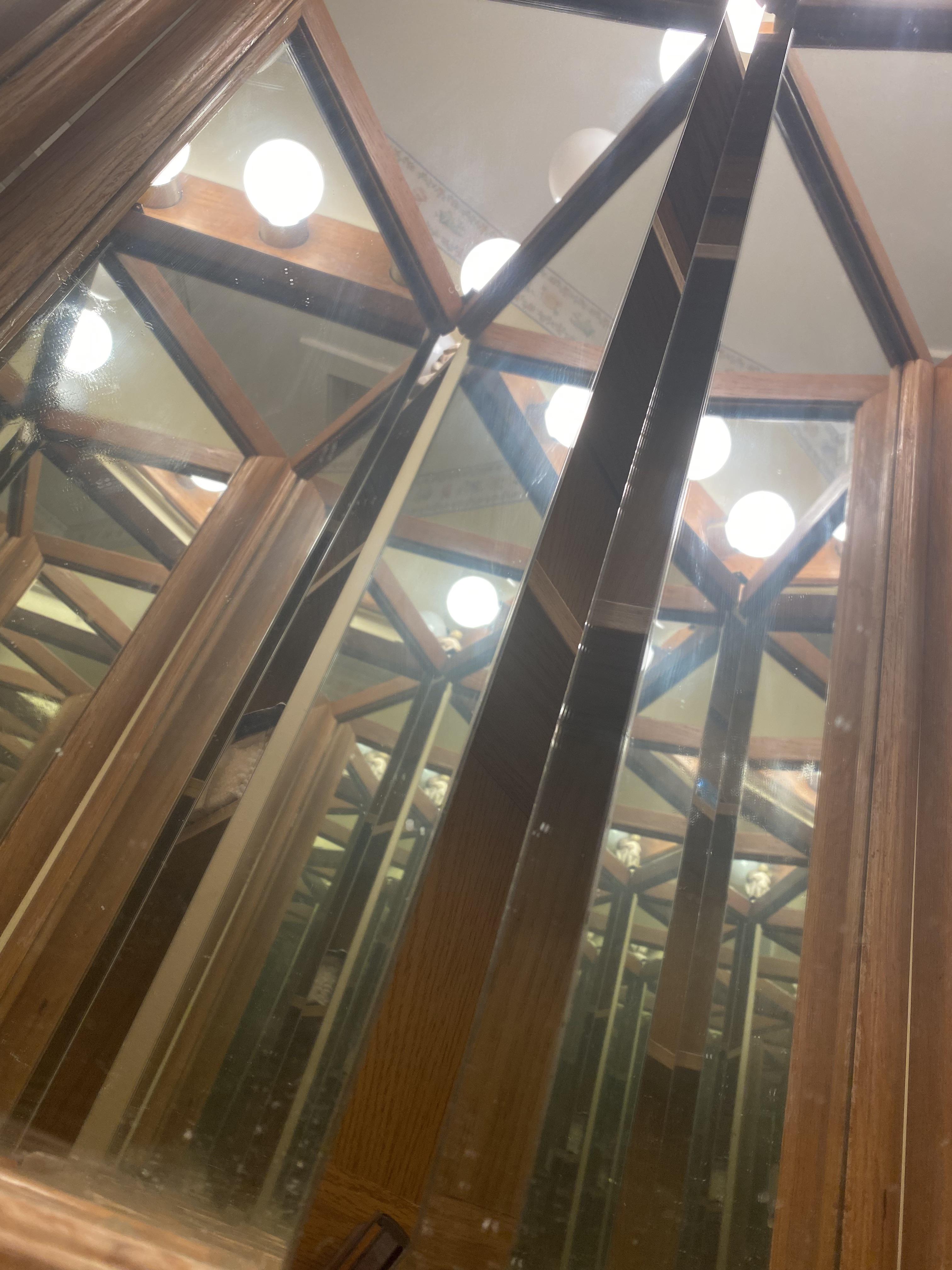 Photo taken inside a bathroom mirror folded in on itself | Scrolller