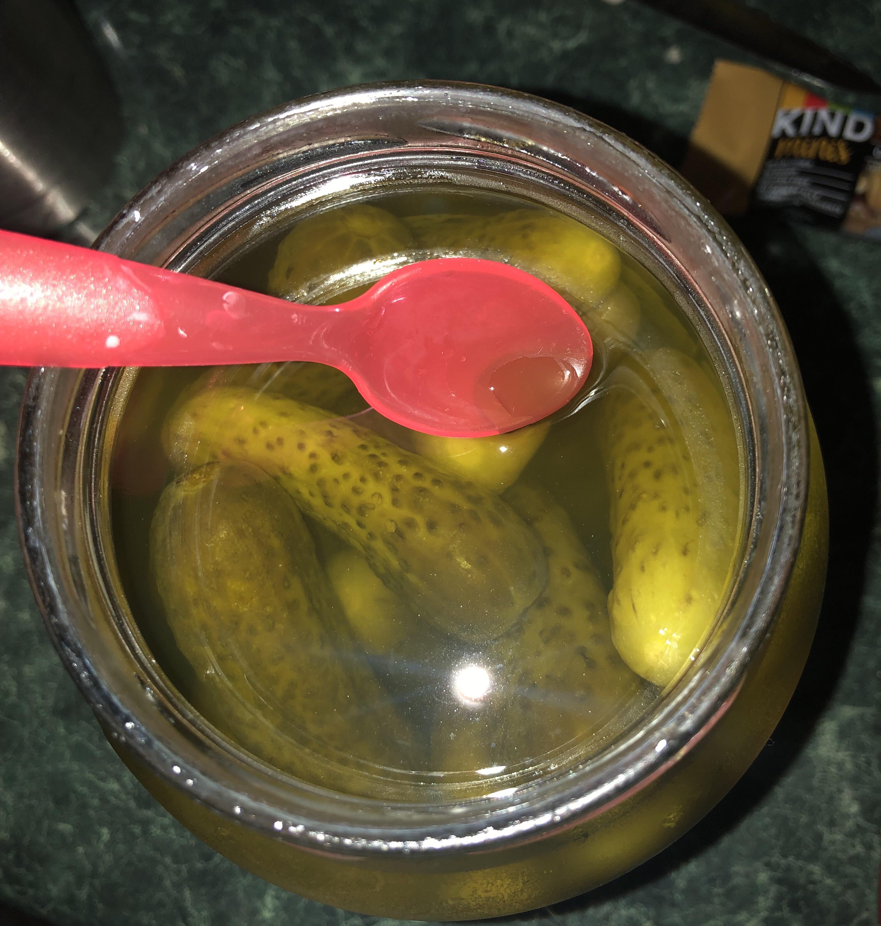 pickle juice consumed straight from jar with baby spoon | Scrolller
