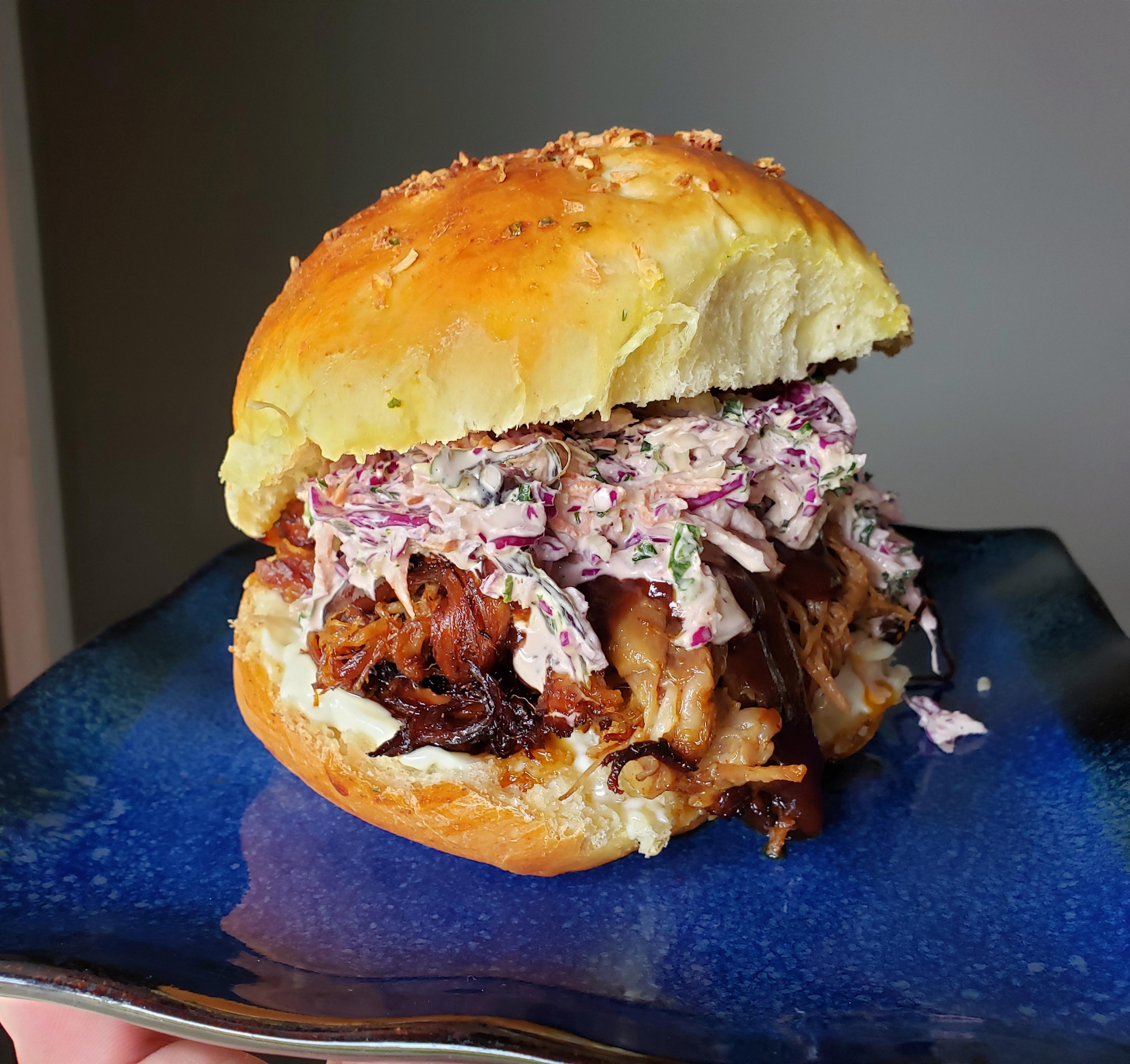 Pulled pork and coleslaw on fresh onion buns | Scrolller