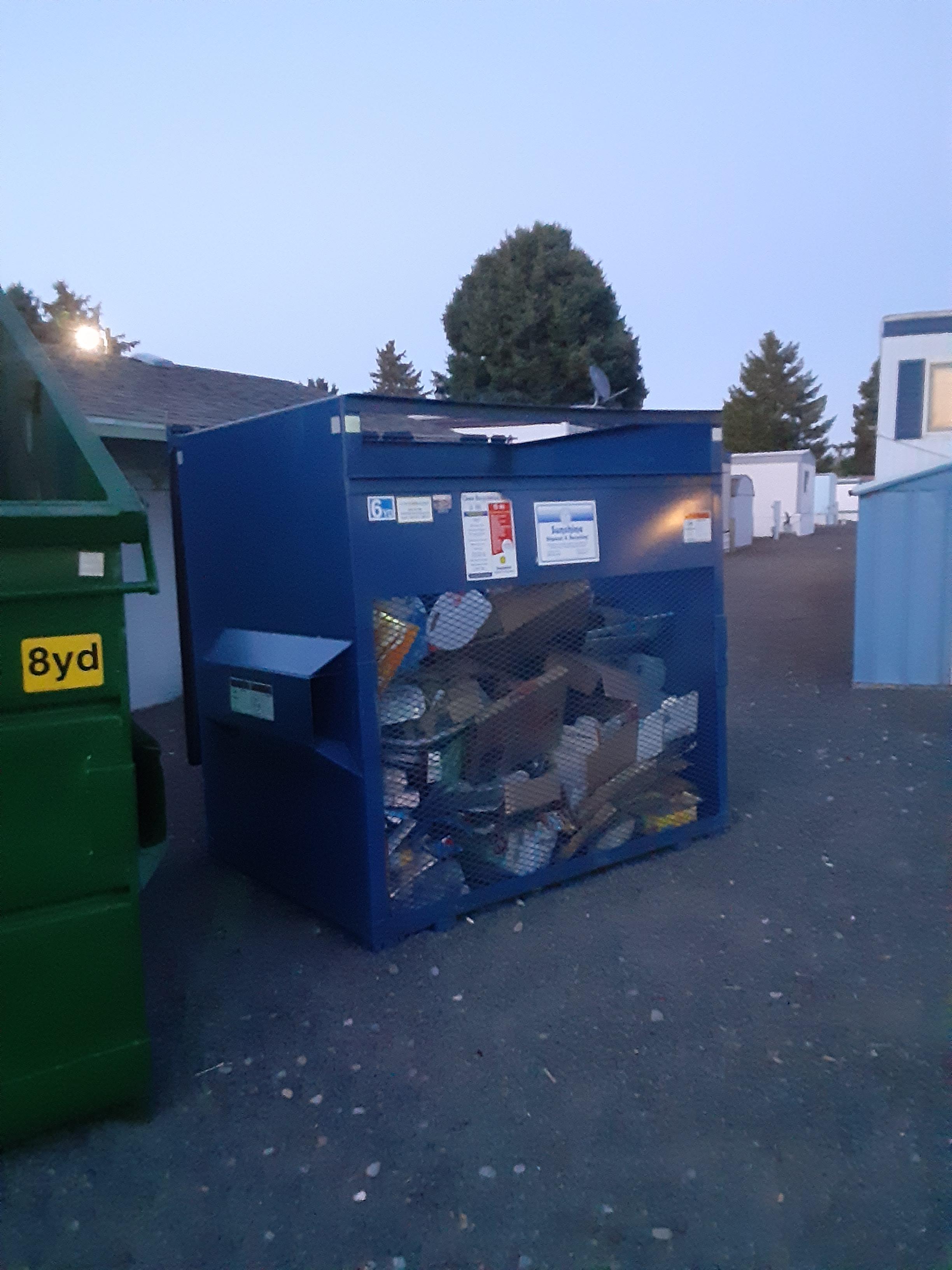 Recycling bin has smaller hole so people have to actually flatten boxes instead of just throwing ...