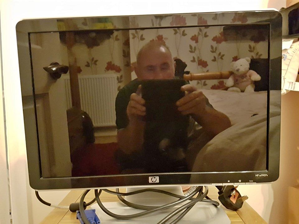 Reflective head reflected in monitor | Scrolller