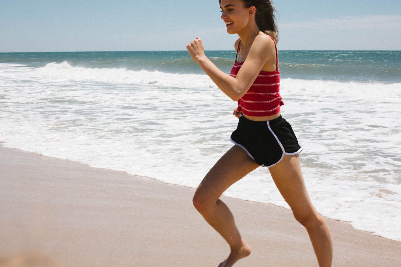 Running up the beach | Scrolller