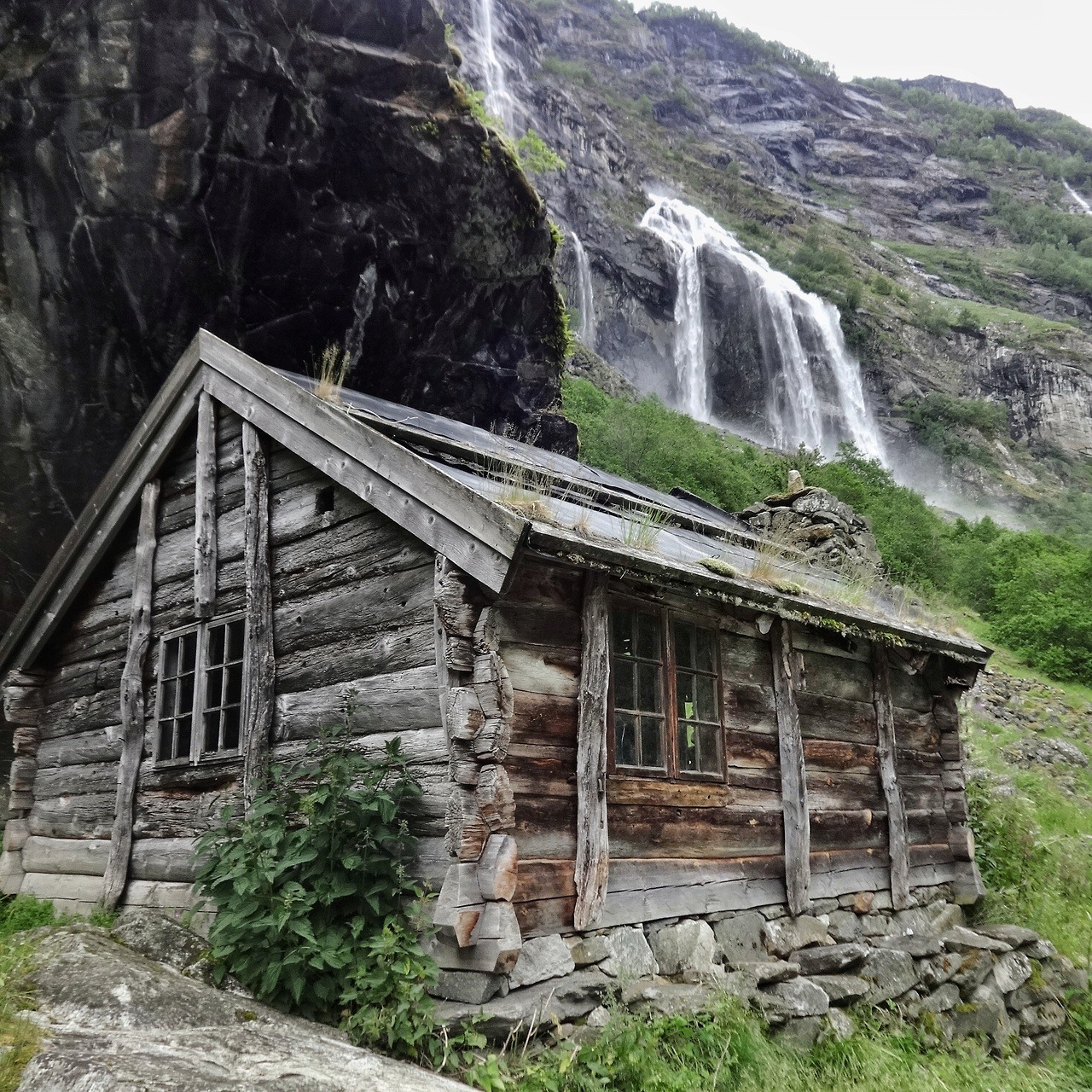 Rustic cabin by a waterfall in Aurlandsdalen, Norway | Scrolller