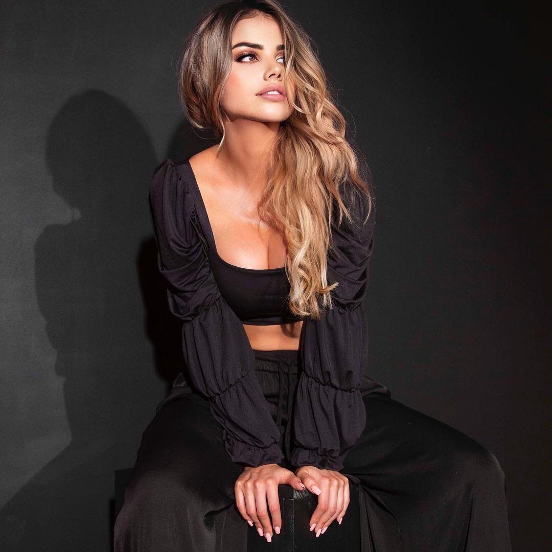 Seated In Black | Scrolller