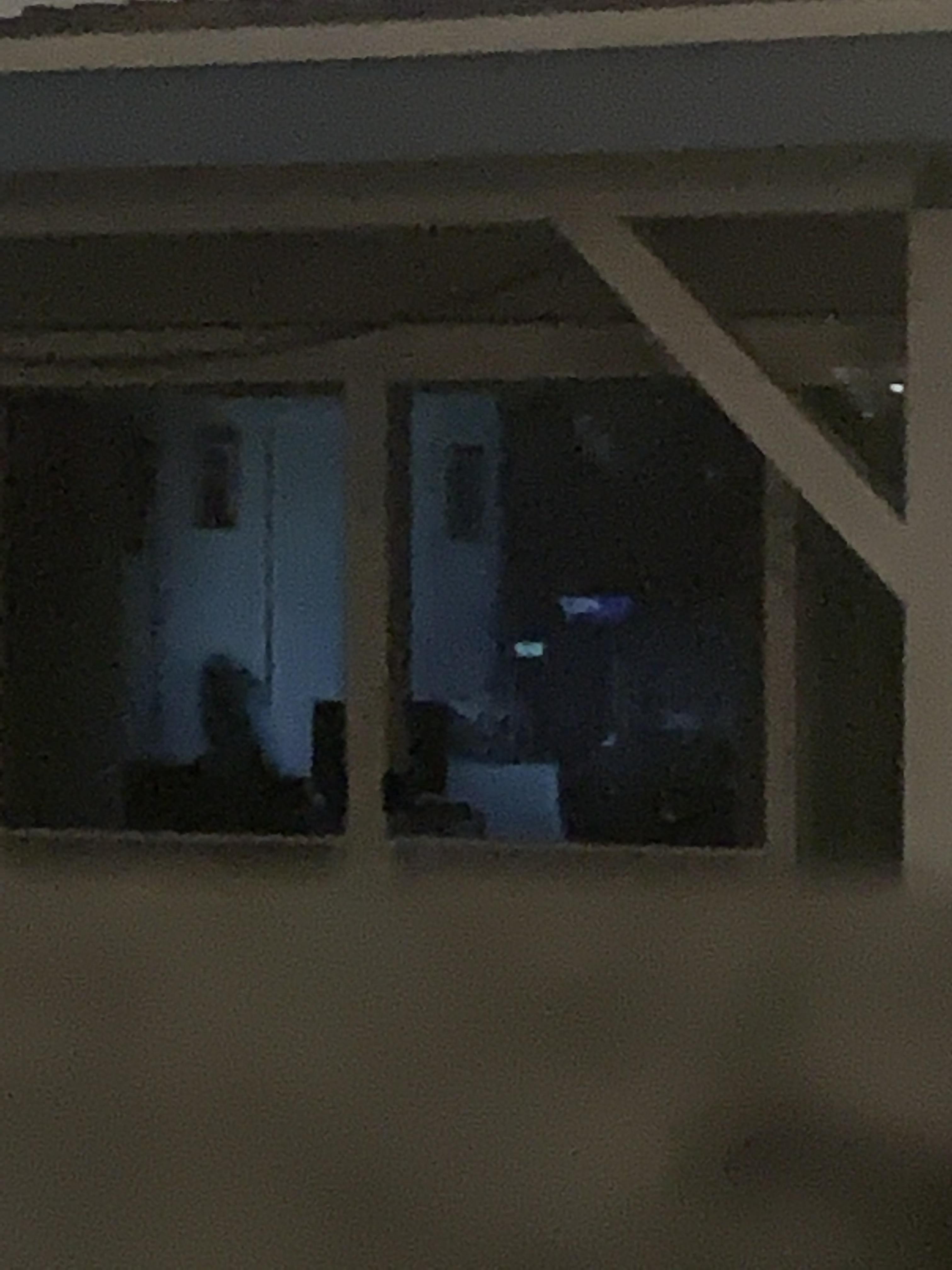 Shadow figure watching TV. | Scrolller