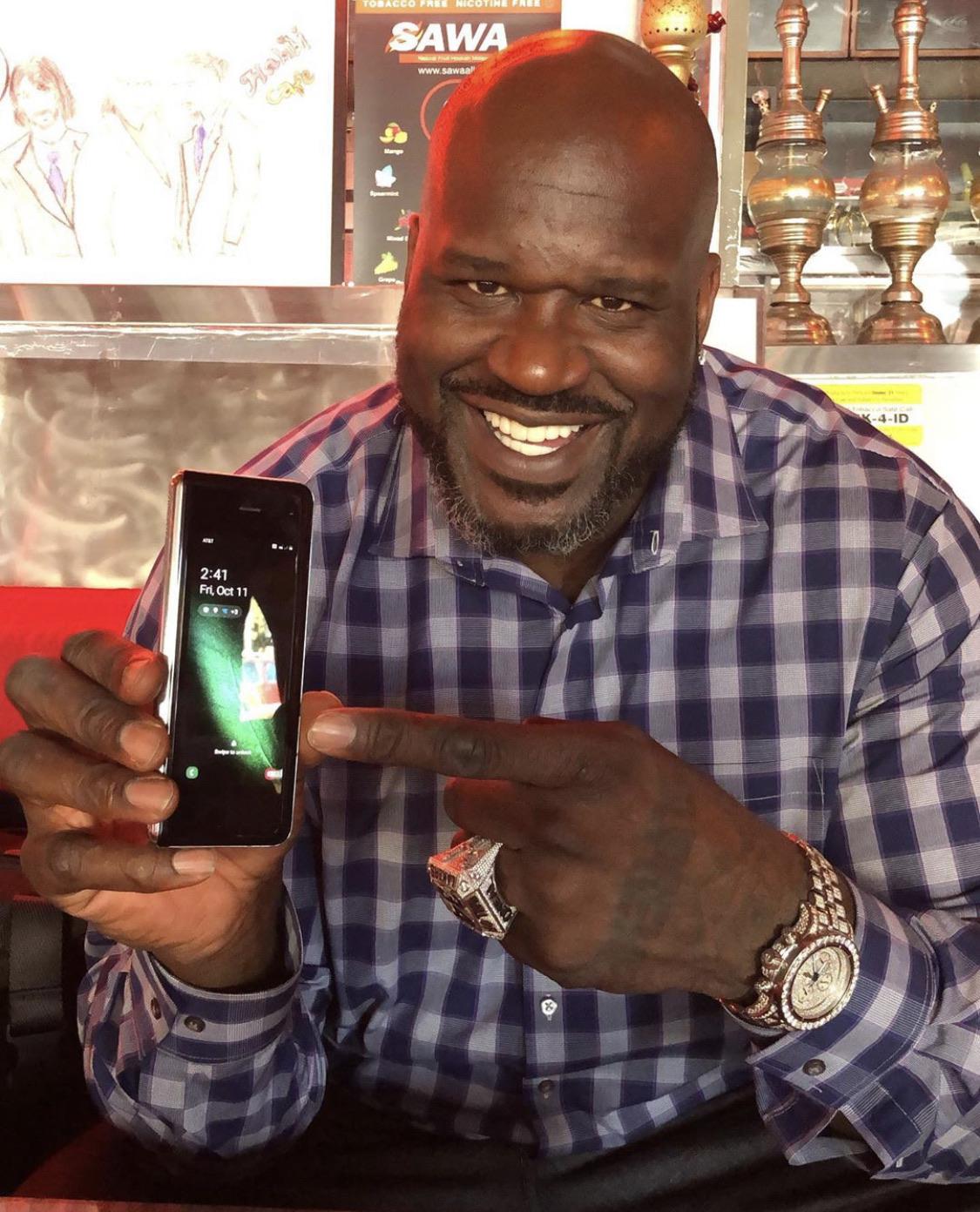 Shaq holding the new Galaxy Fold. | Scrolller