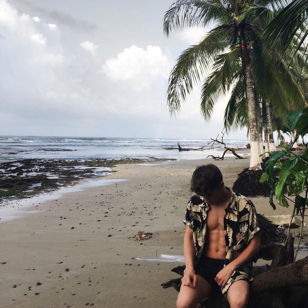 Sitting by the ocean | Scrolller