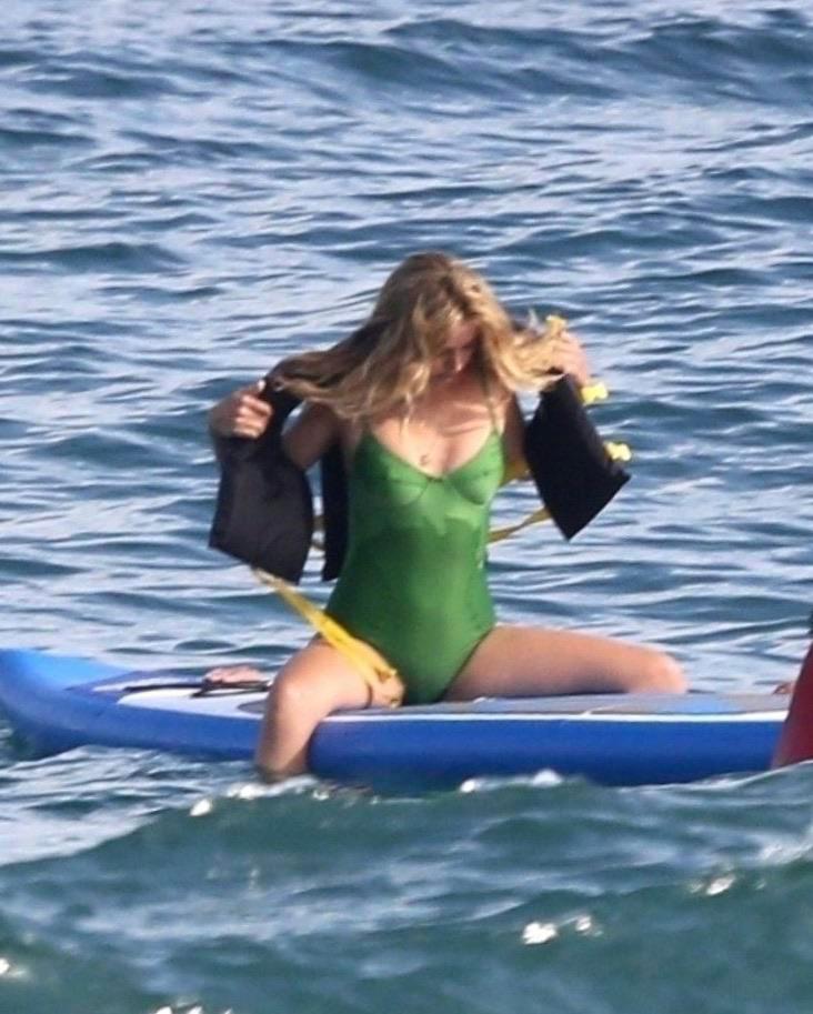 Sitting on a Surfboard | Scrolller