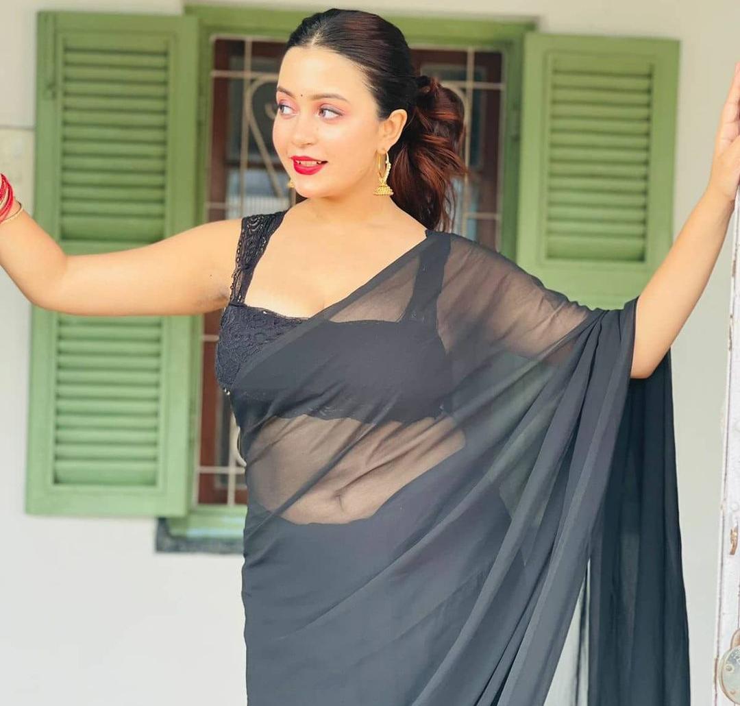 Sneha Karmakar navel in black sleeveless blouse and transparent saree | Scrolller