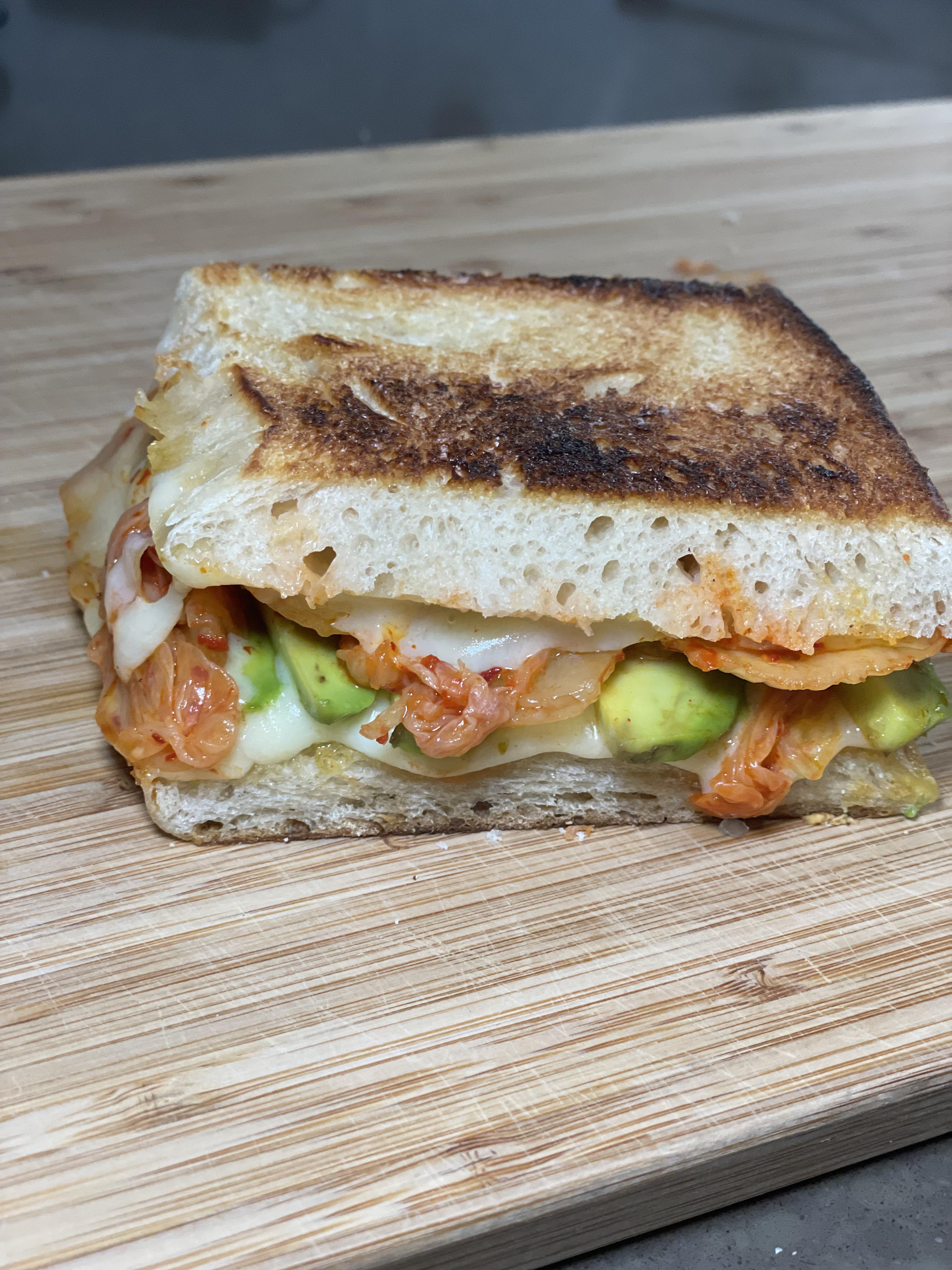 Sourdough, extra sharp cheddar, avocado, and my mom’s kimchi toasted in a cast iron pan! | Scrolller
