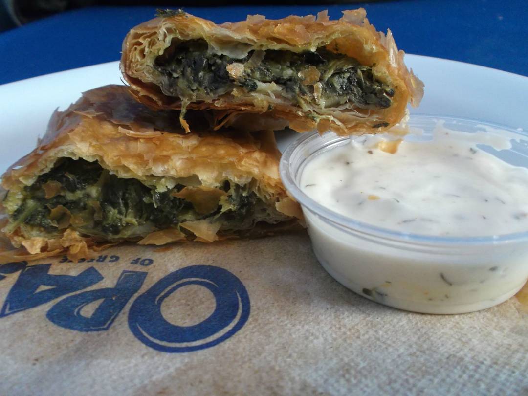 Spanakopita (spinach and feta cheese wrapped in phyllo pastry) from Opa! Souvlaki | Scrolller