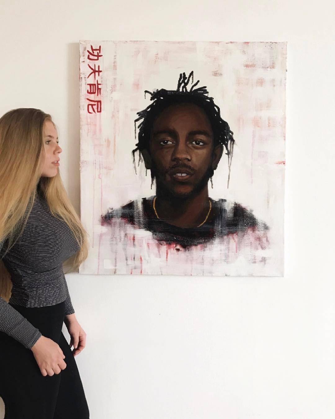 Standing next to her artwork | Scrolller