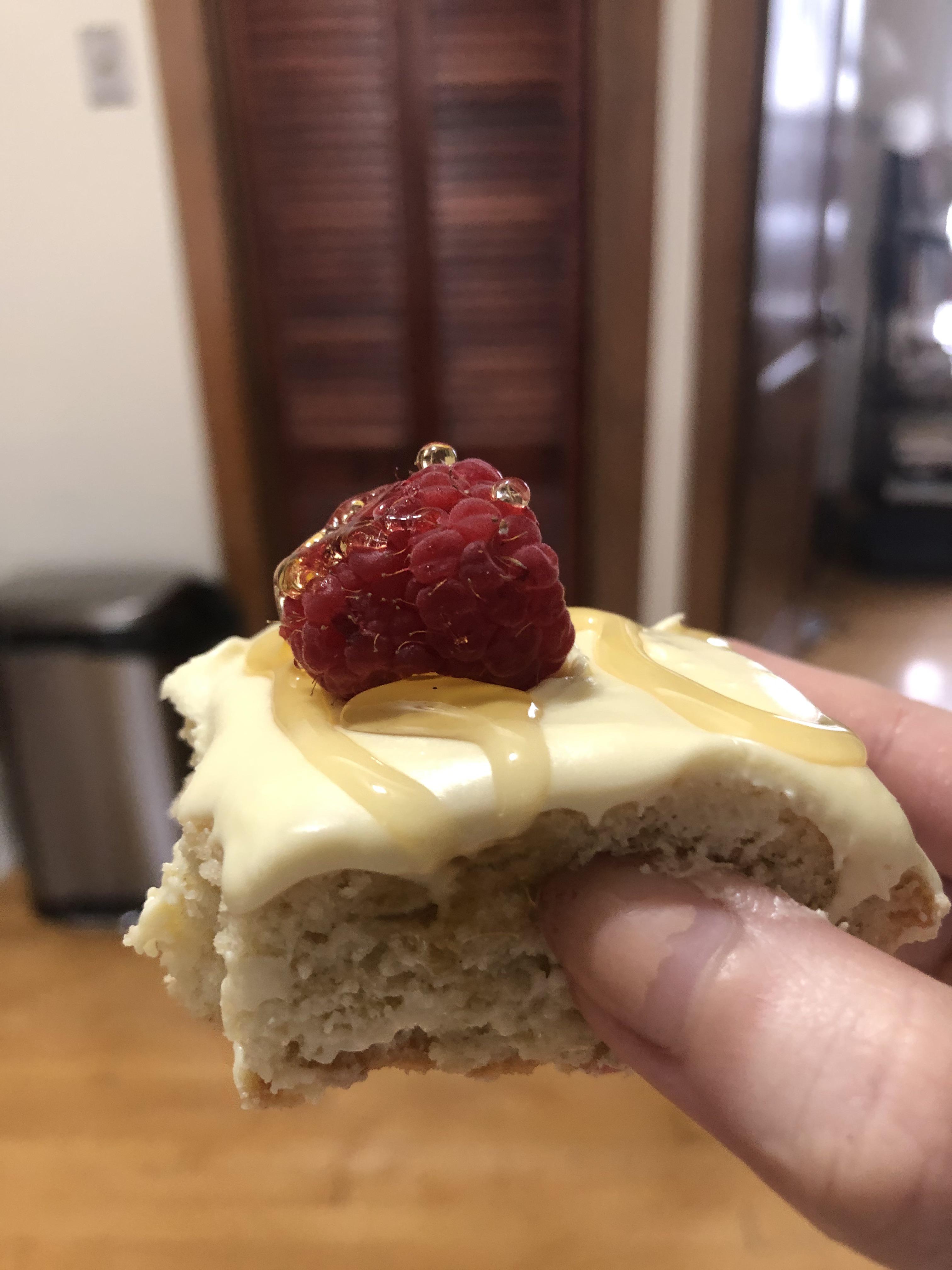 Sugar cookie bar with buttercream, honey, and raspberries | Scrolller
