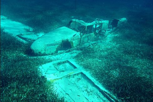 sunken rotting plane in the deep | Scrolller