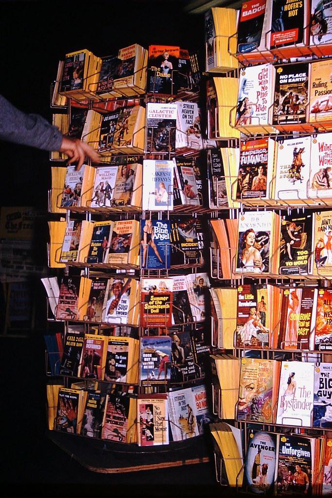 The pulp novel rack at Detroit Metro Airport, 1959 | Scrolller