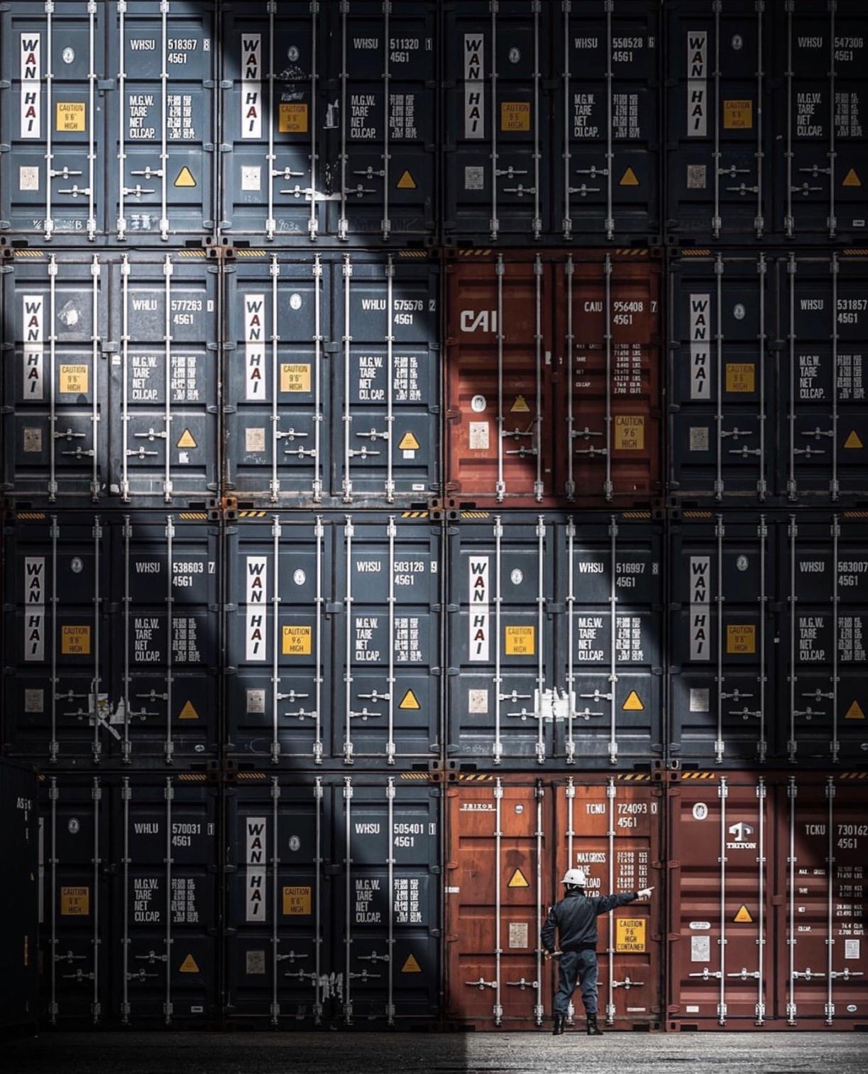 The worker and the shipping containers | Scrolller