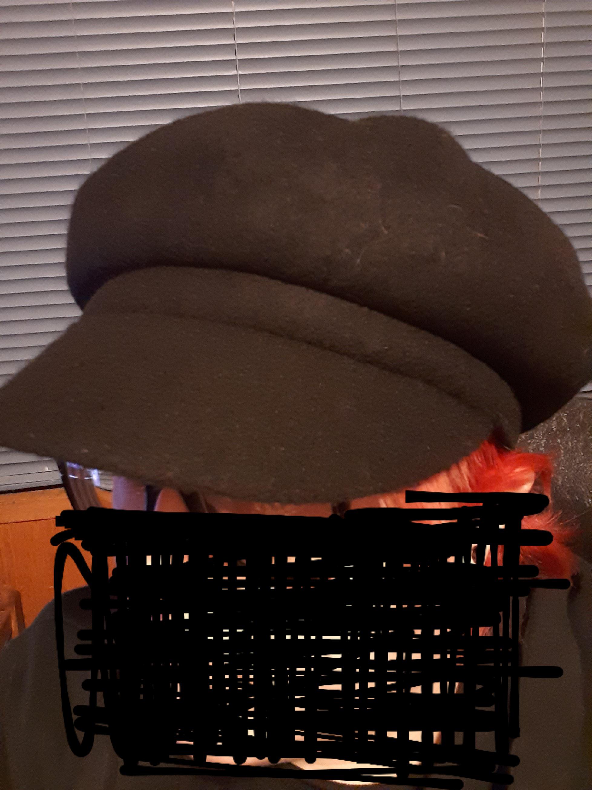 This has been driving me crazy. What type of hat is this? It's like a newsboy but it doesn't ...