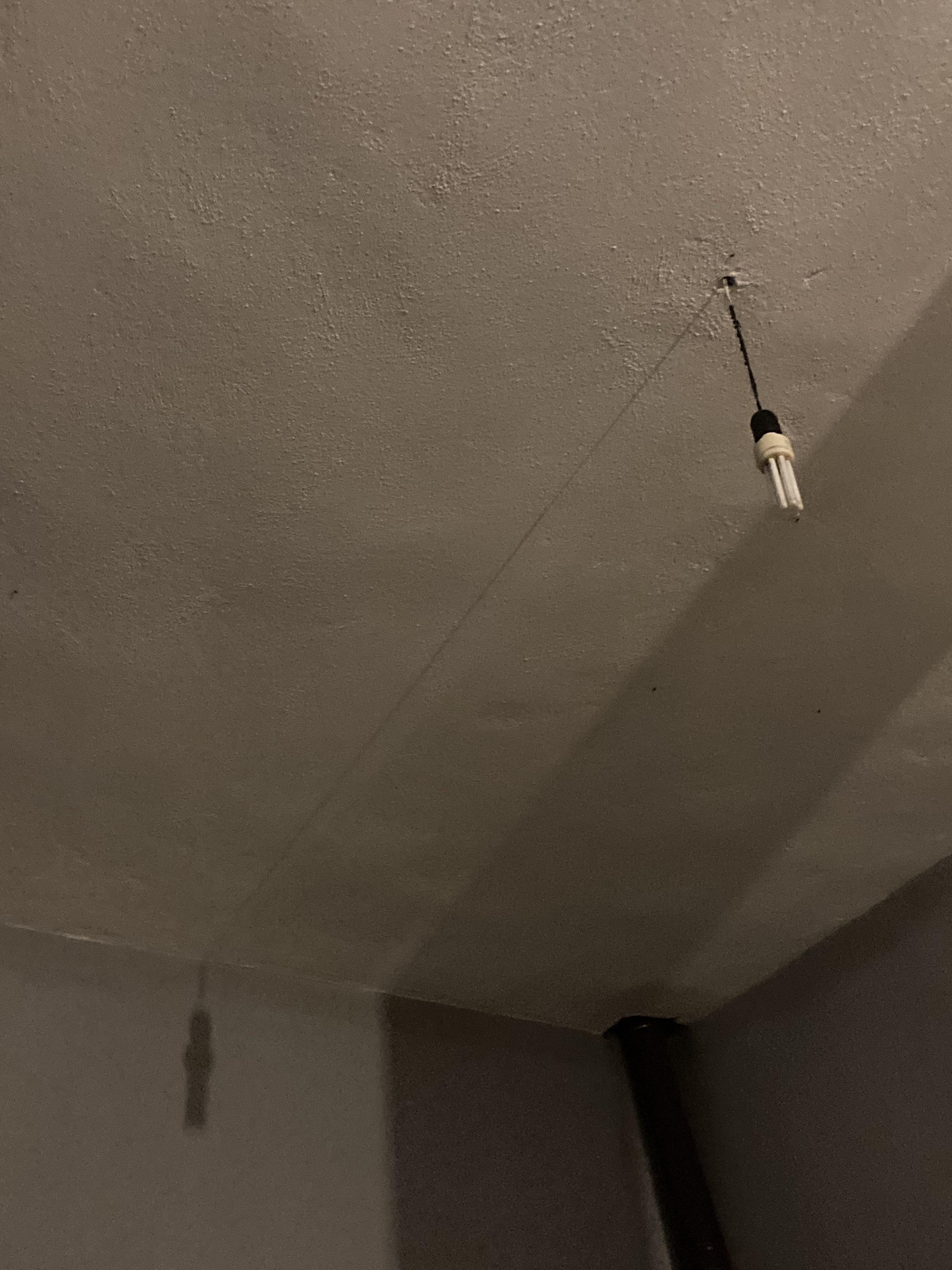 This light's shadow looks like a hanging man | Scrolller