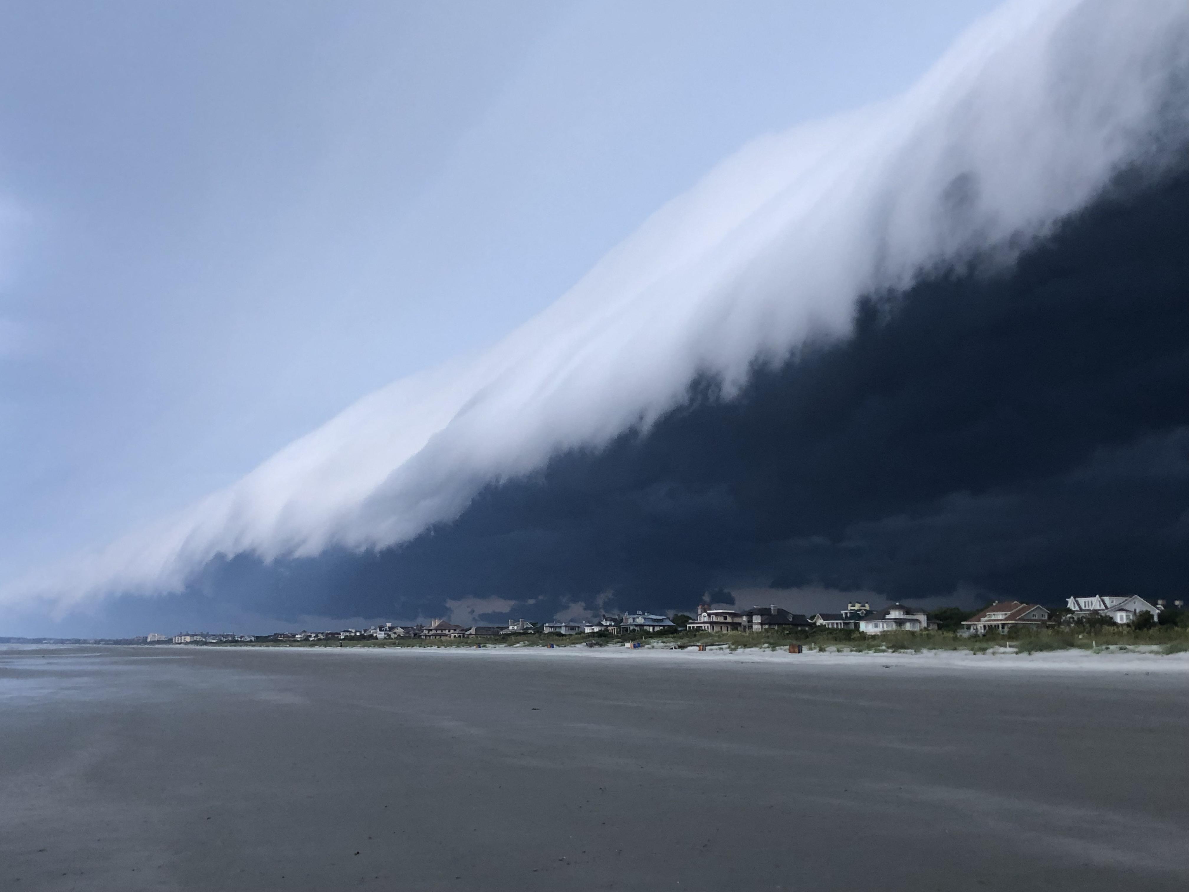 this tsunami-like cloud over the beach | Scrolller