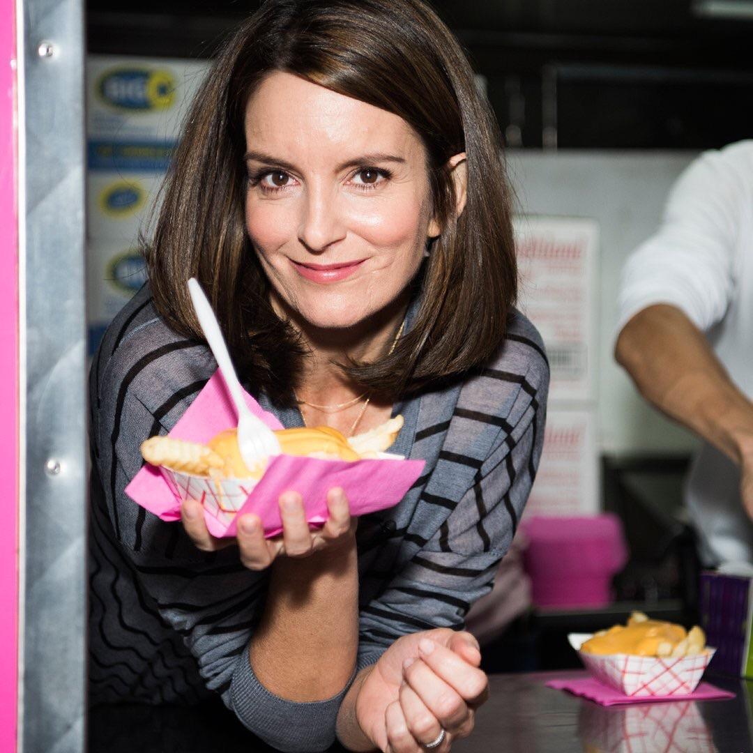 Tina handing out cheese fries in Times Square on Mean Girls Day. | Scrolller