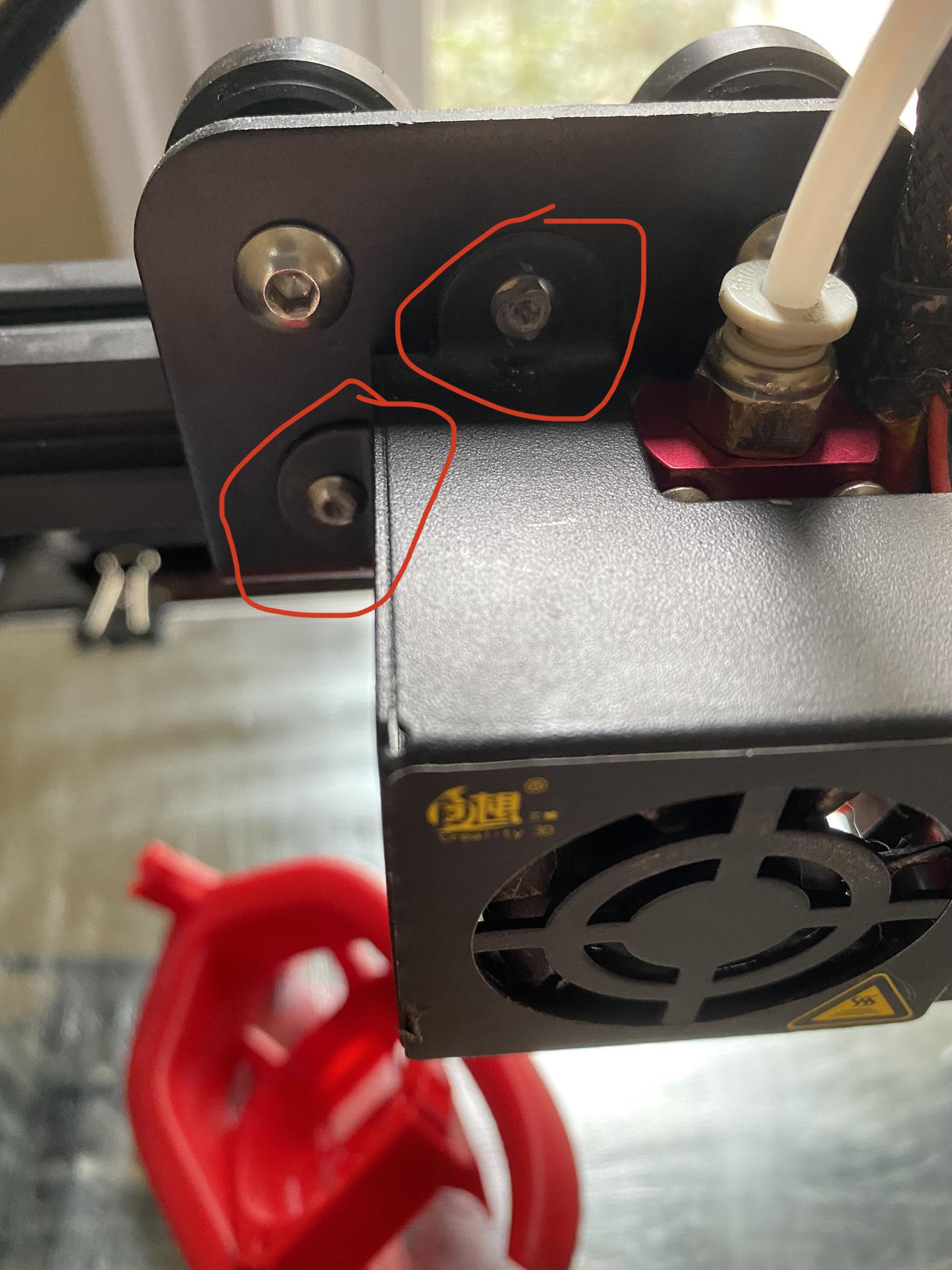 Trying to install a custom hot end body, but these two screws are totally stuck. I’ve tried ...