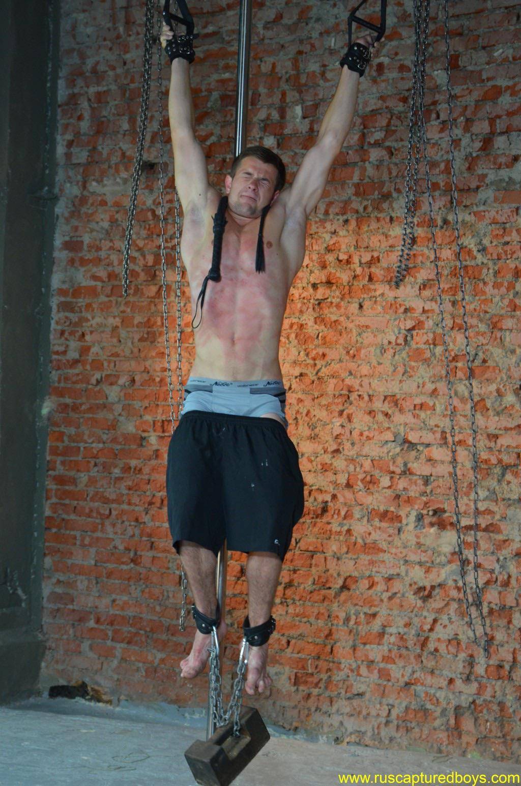Weighted suspension after whipping. A pic from RusCapturedBoys.com video. | Scrolller