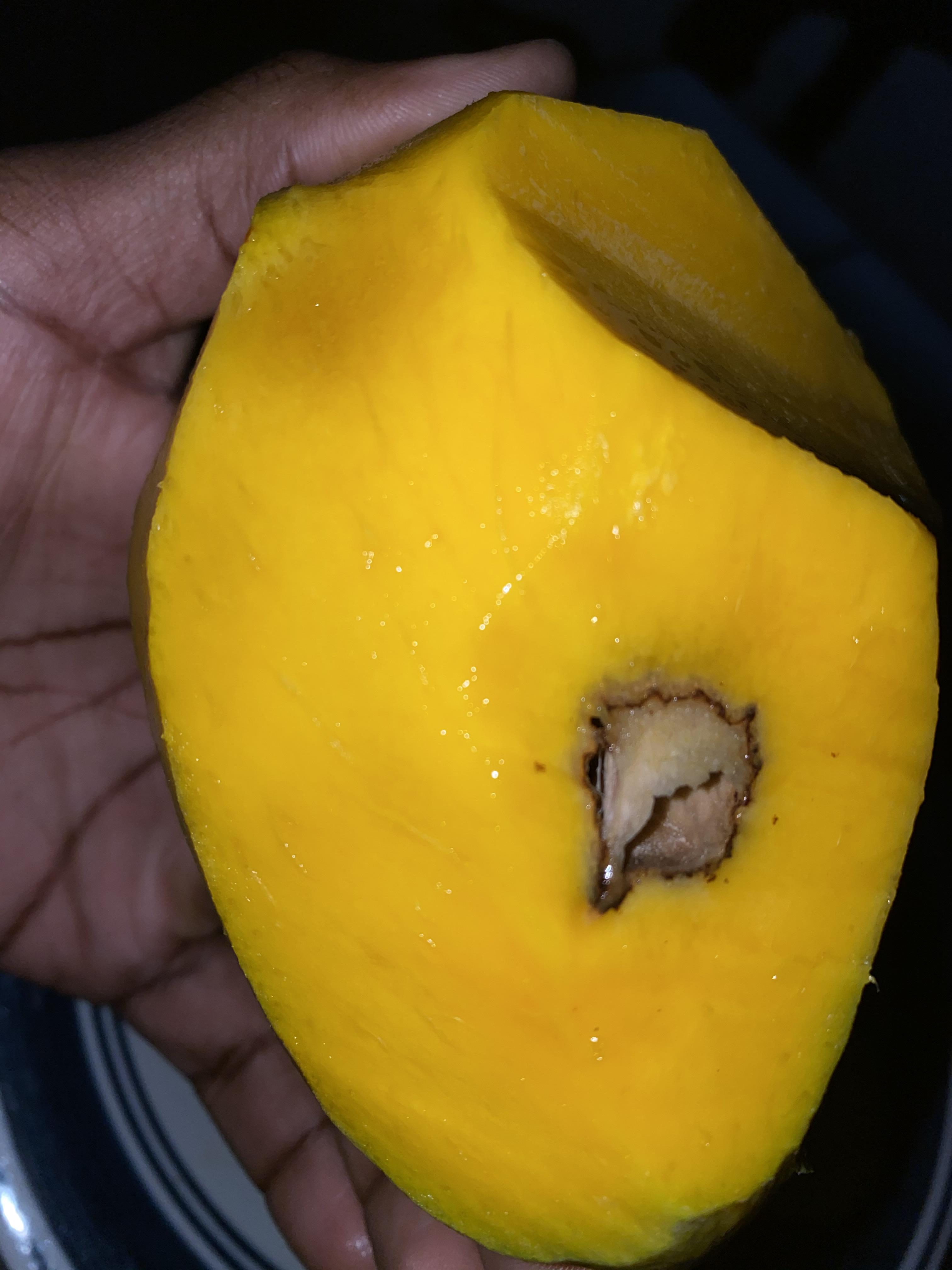 Why does the seed in this mango look like that? Also, is it safe to eat the areas around it ...
