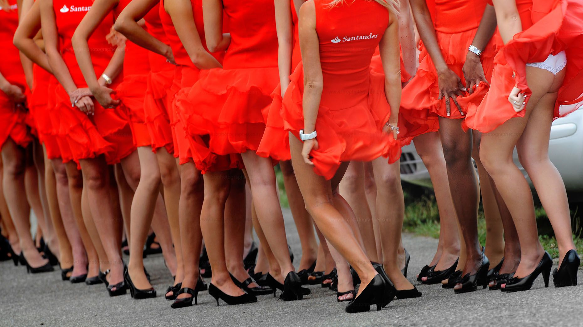 Wind blowing the red dress on the right, beautiful panties exposed (x-post /r/PromoBabes ...
