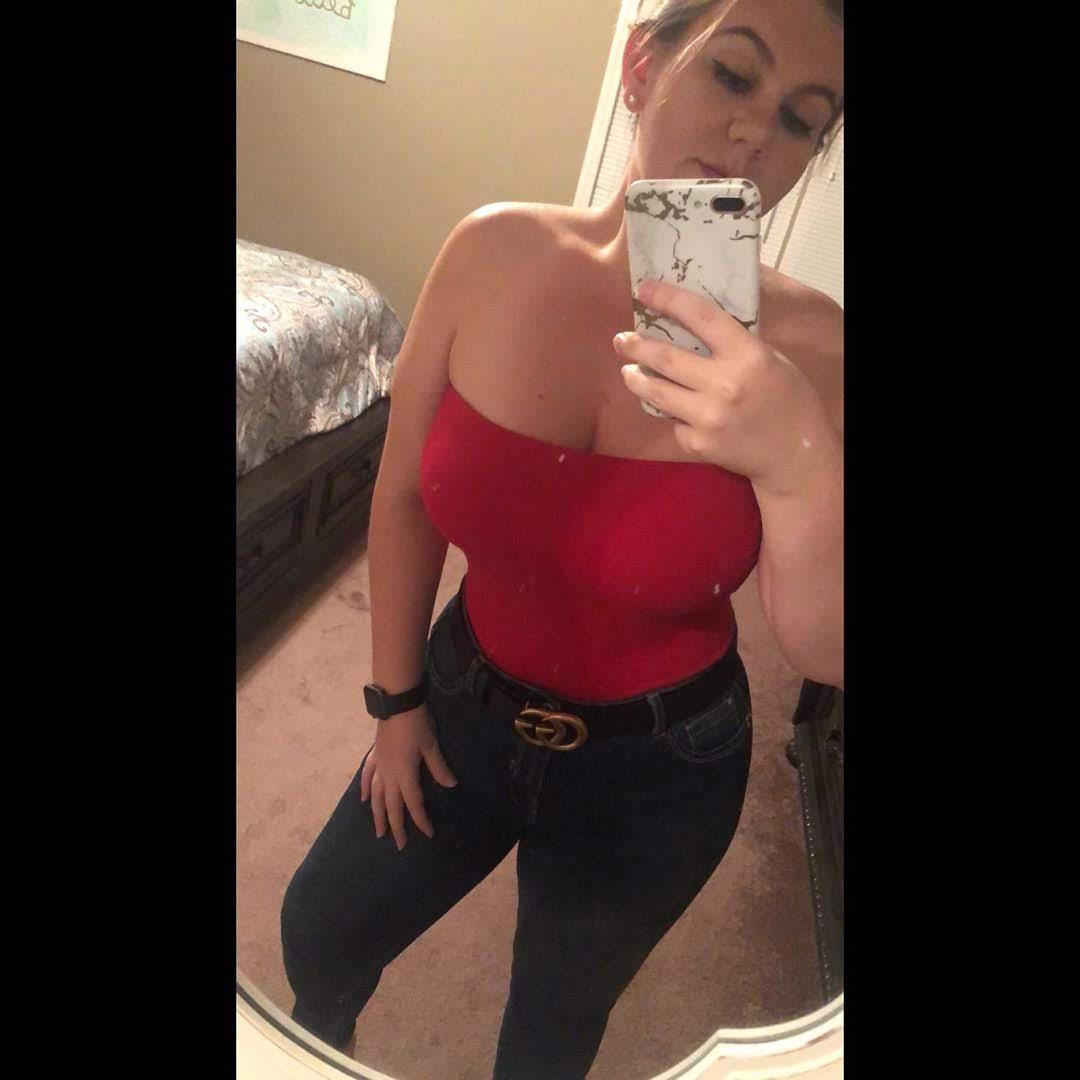 Woman in red tube top and jeans | Scrolller