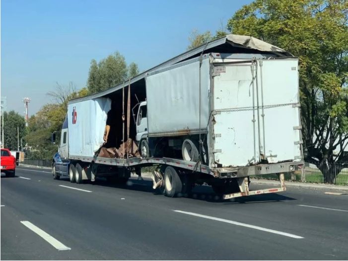 XPO delivering one of it's new trucks | Scrolller