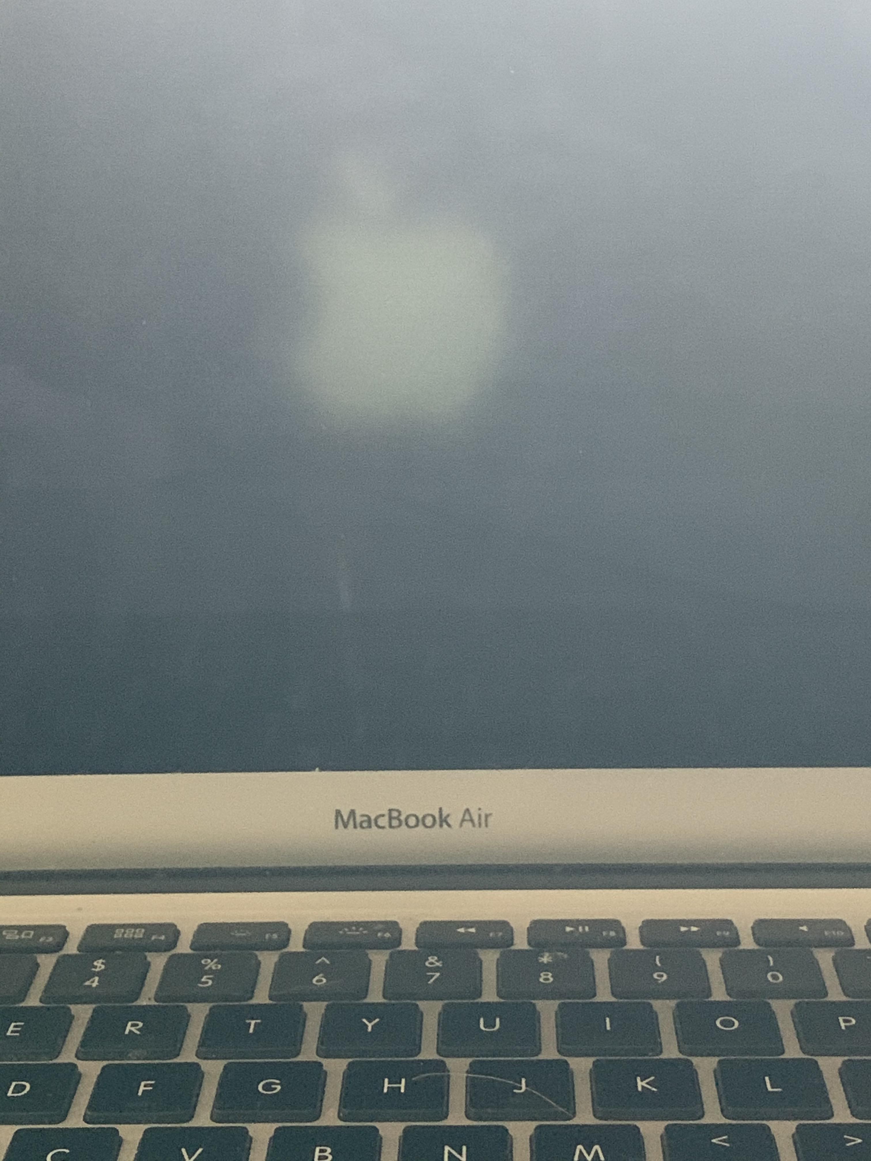 You can see apple logo through the screen of my Mac. | Scrolller