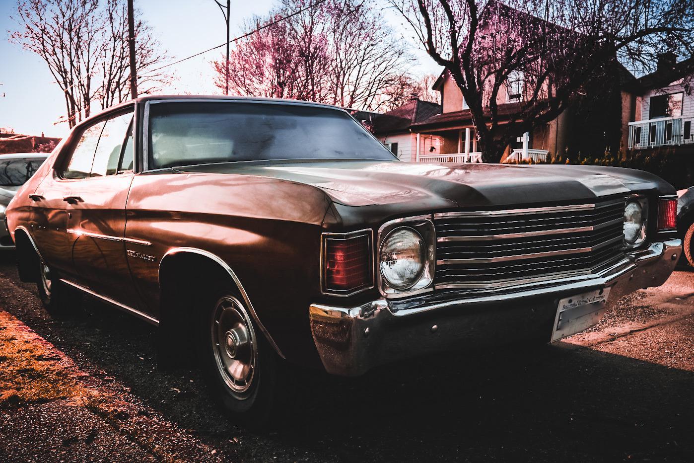 2nd generation Chevy Malibu caught in the rising sun. | Scrolller
