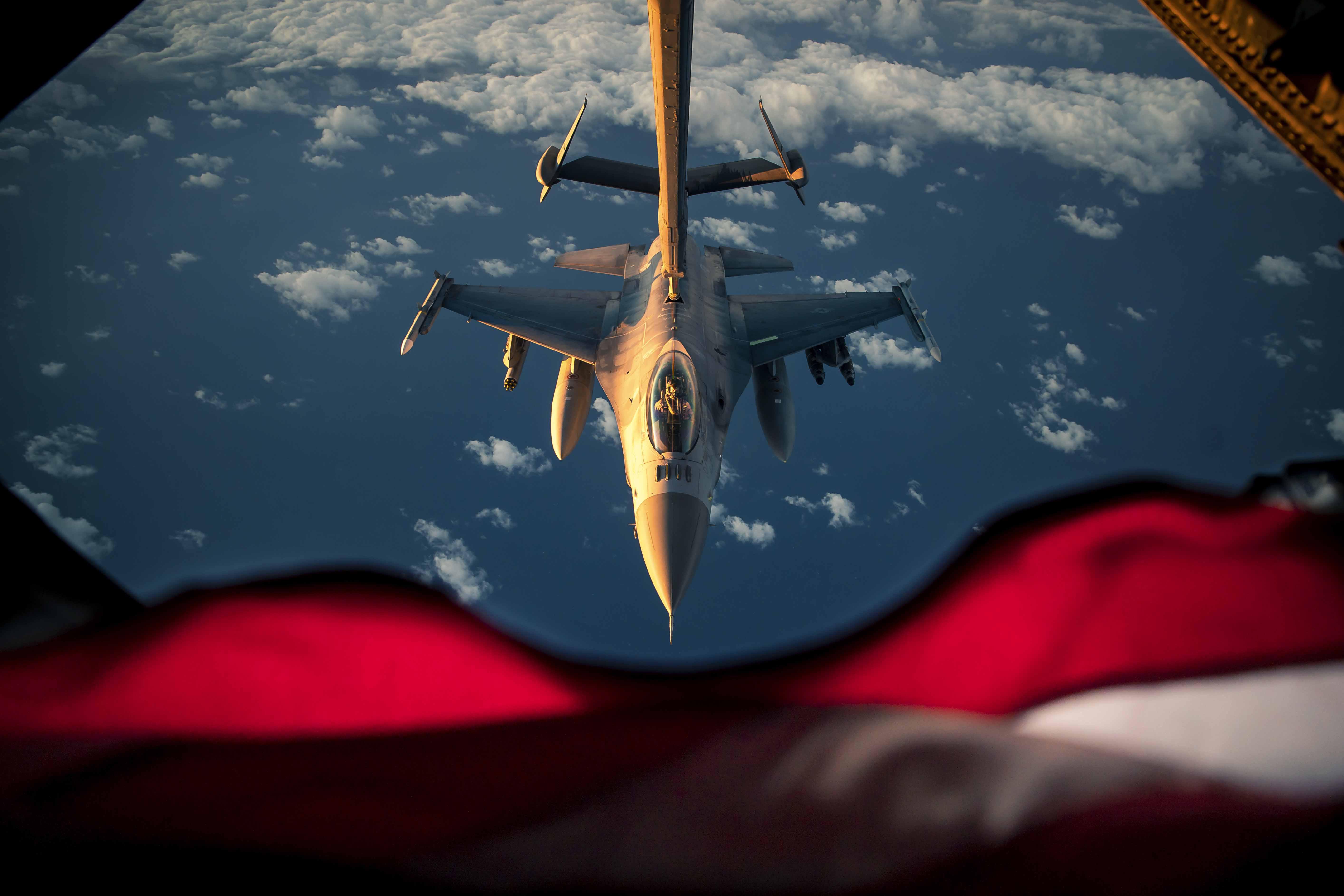 An Air Force F-16 Fighting Falcon receives fuel from a KC-10 Extender during Operation Octave ...