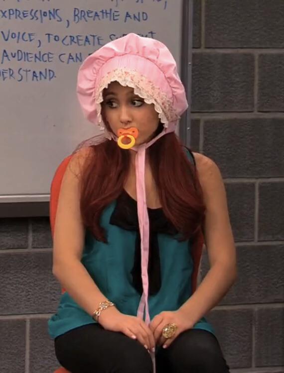 Ariana Grande using a pacifier. | Scrolller