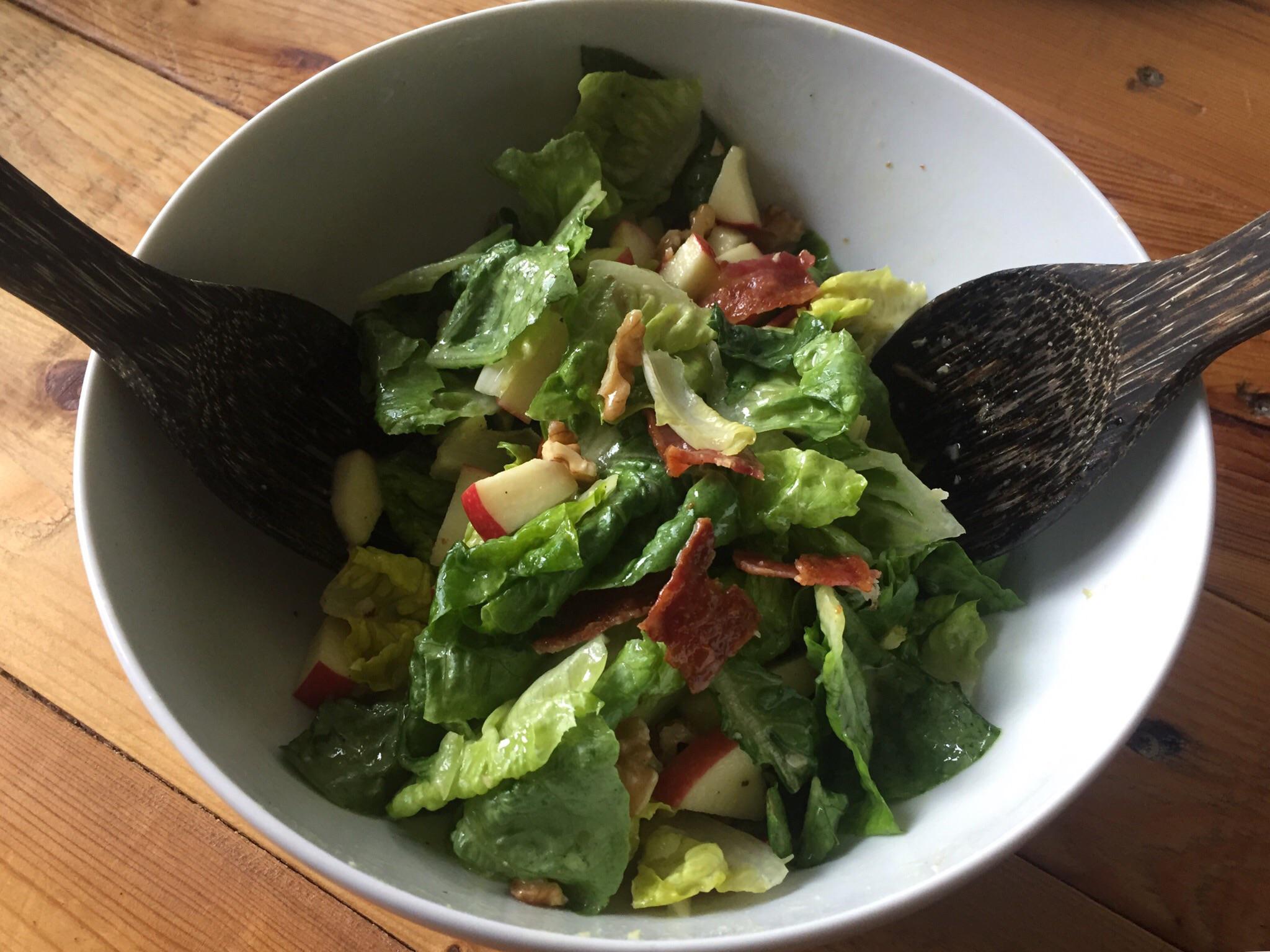 Autumn salad: lettuce, apple, walnuts and bacon (with olive oil, vinegar, mustard dressing ...