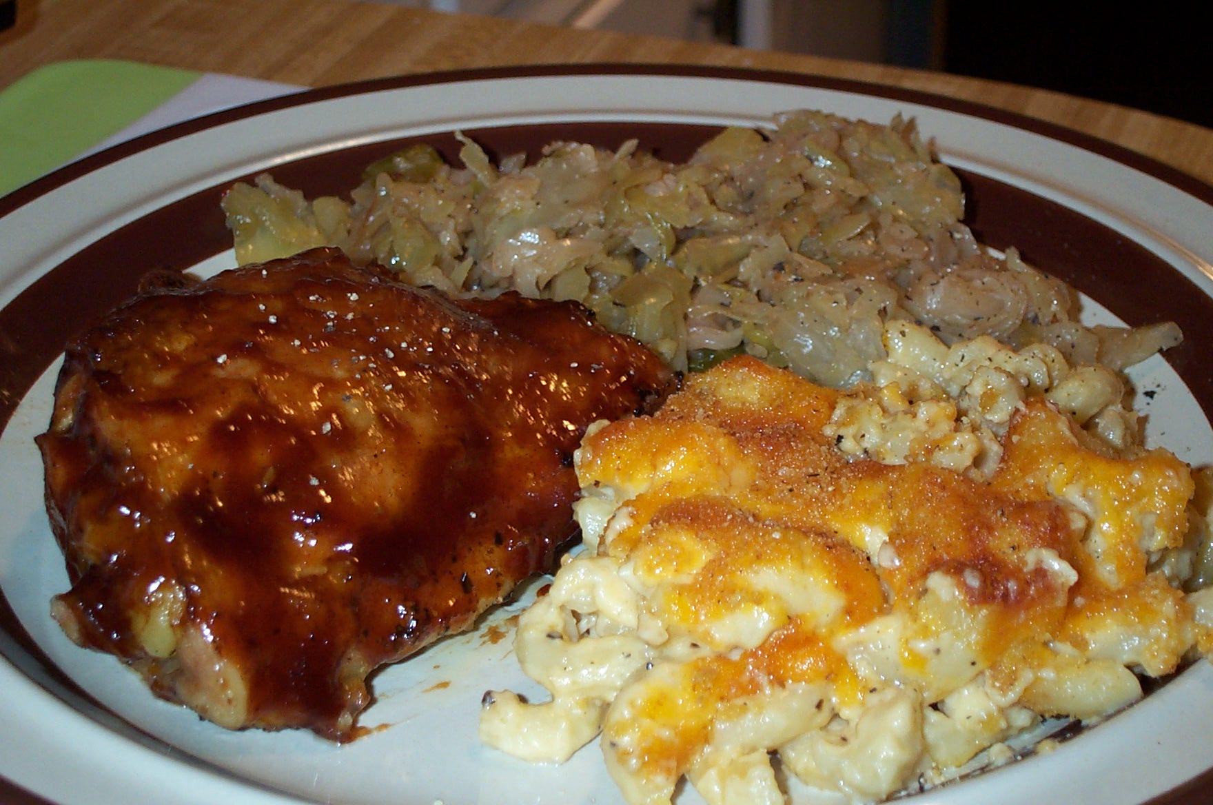 BBQ chicken, macaroni and cheese with fried cabbage. | Scrolller