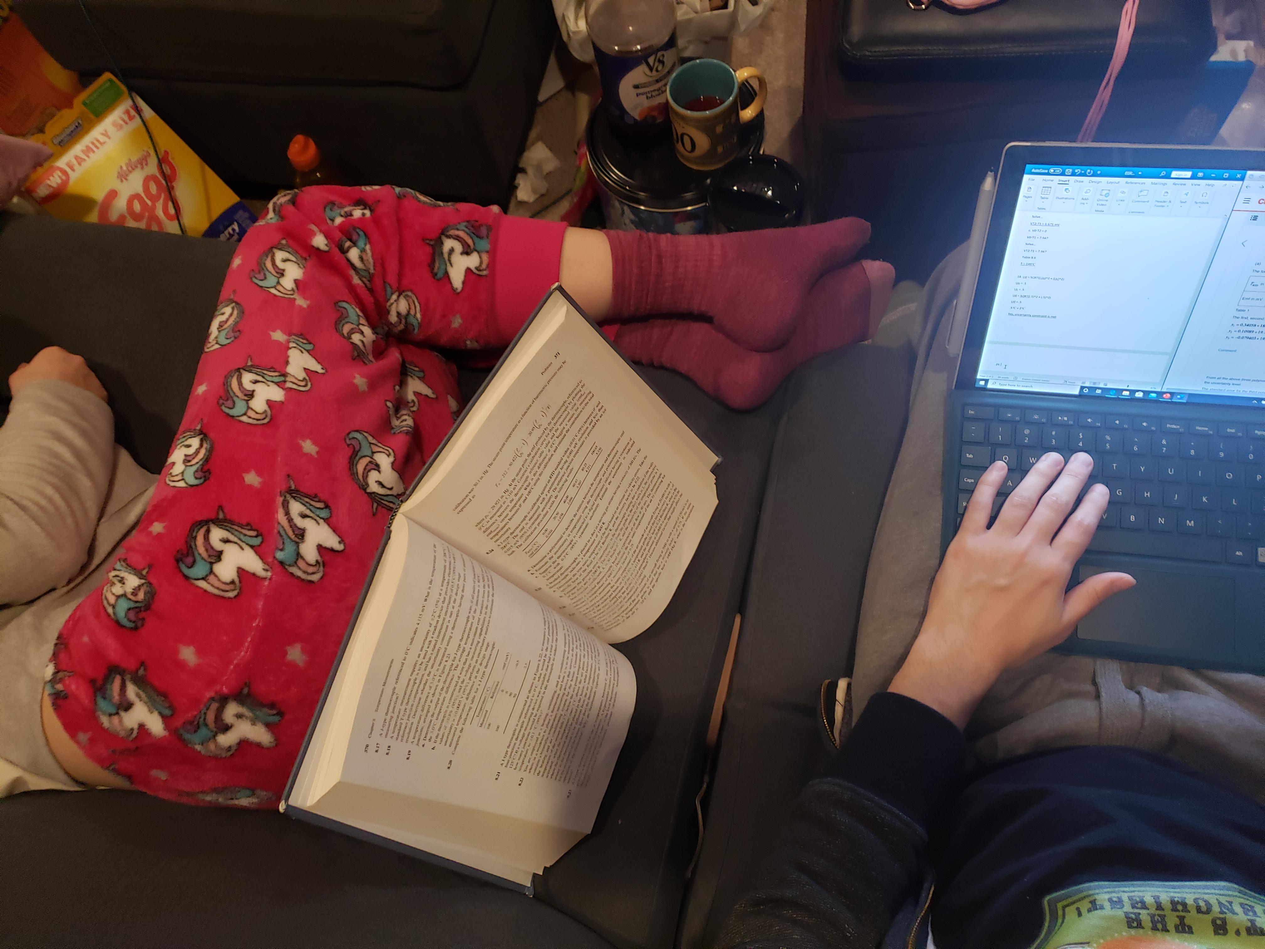 Being helpful holding up Daddy's book while he does schoolwork =^-^= | Scrolller