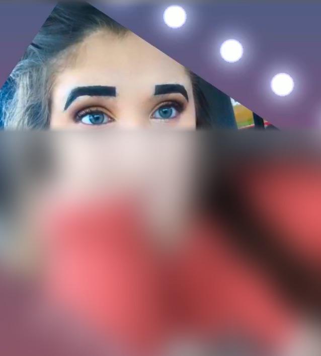 Blurred everything but her eyebrows. Looks like someone used grease paint on her brows. | Scrolller