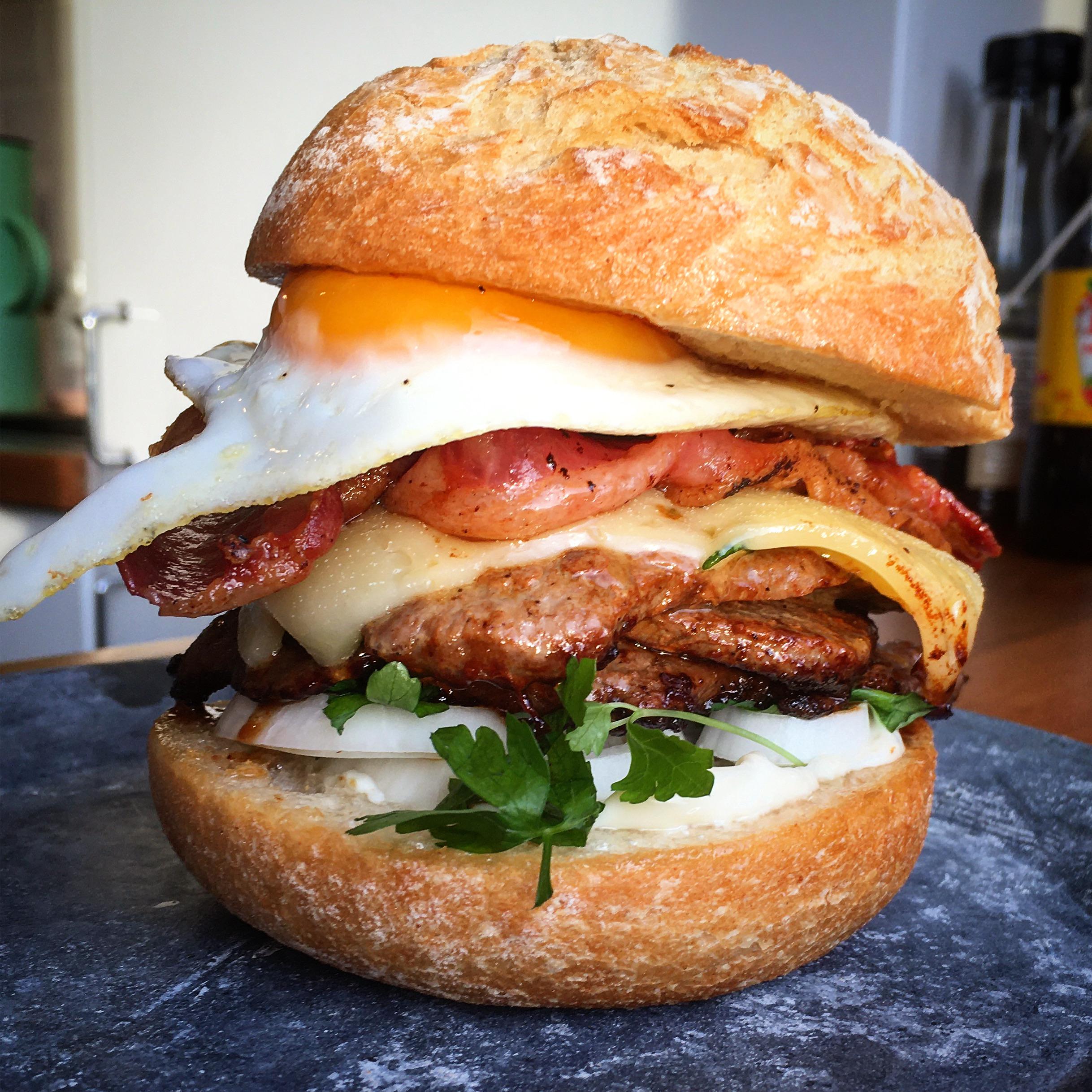 Breakfast sandwich with steak, bacon, cheddar, egg, onion | Scrolller
