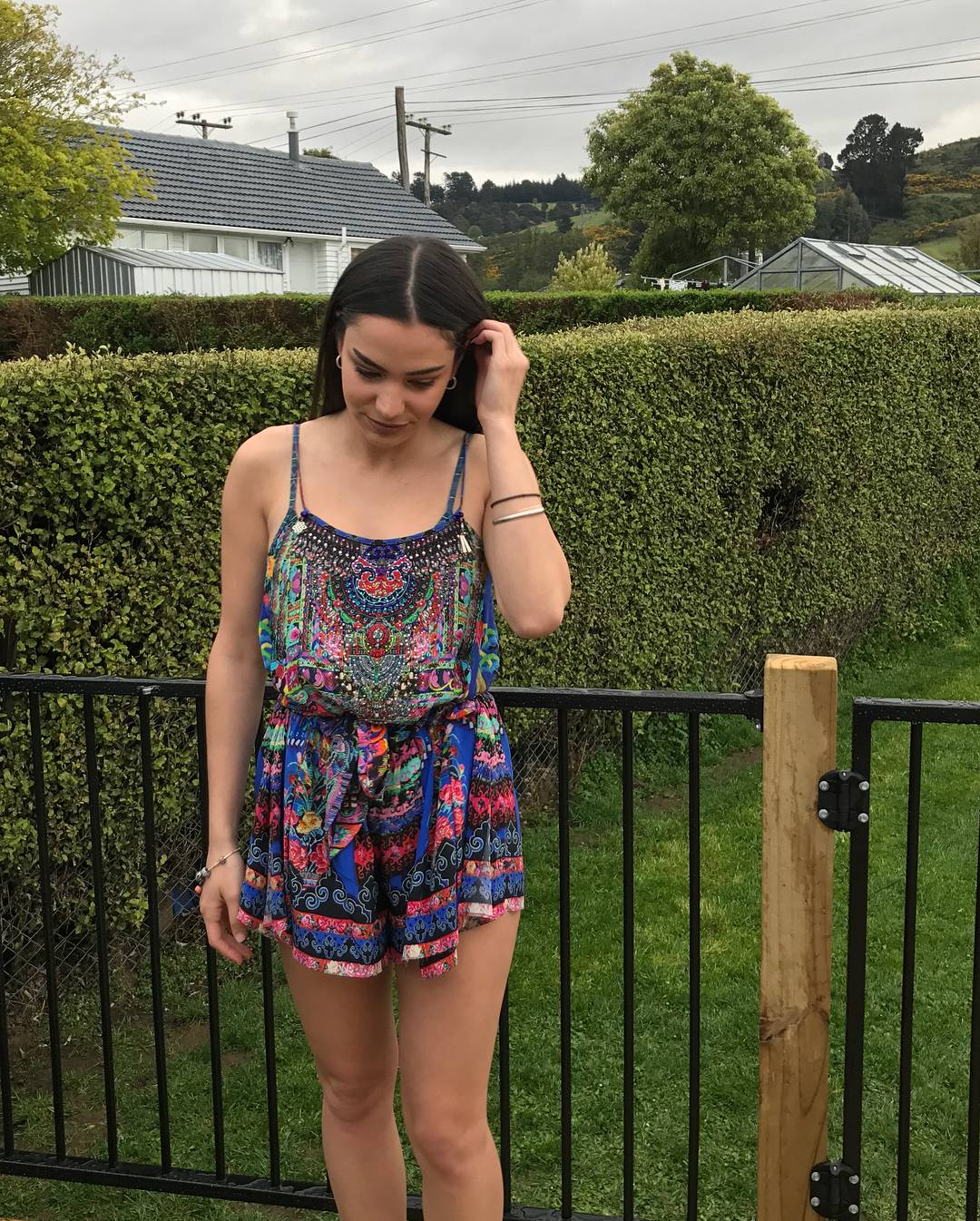 Brushing her hair back | Scrolller