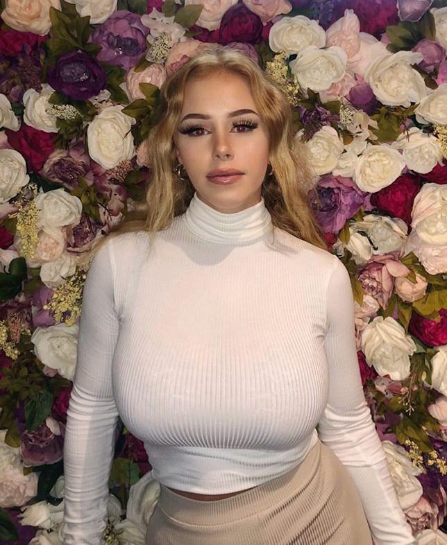 Busty German in white turtleneck | Scrolller