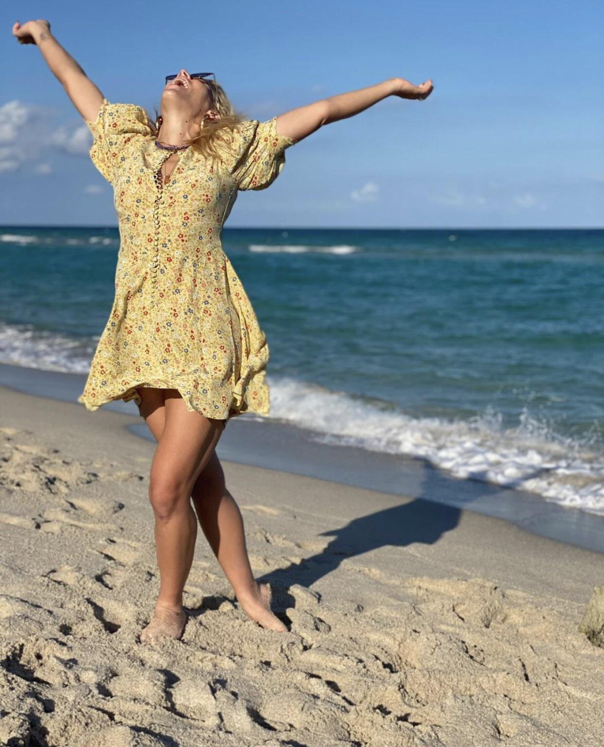 Busy and her lovely legs at the beach | Scrolller