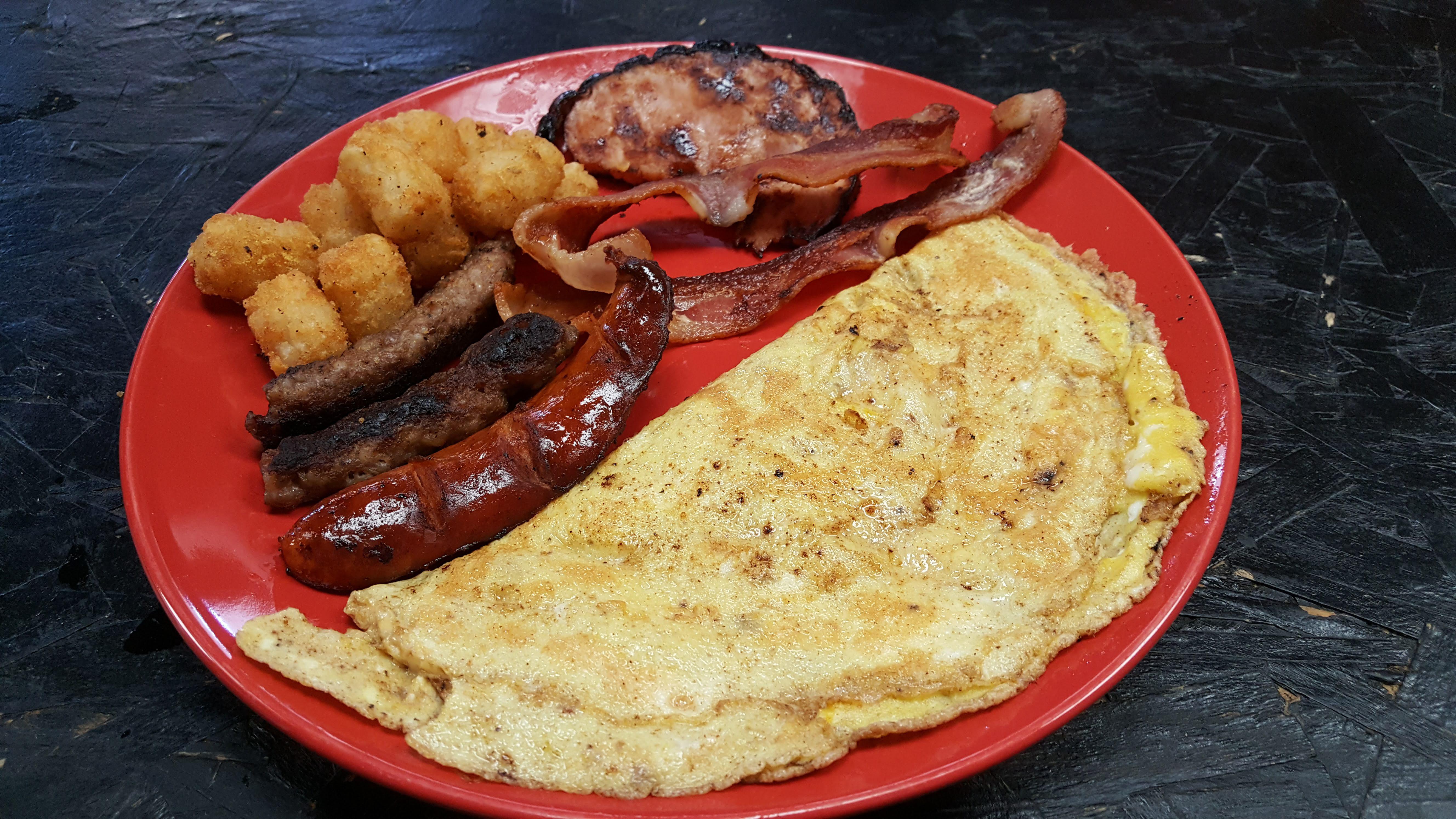 Cheese omelette, sausage, bacon, ham and tater tots. | Scrolller