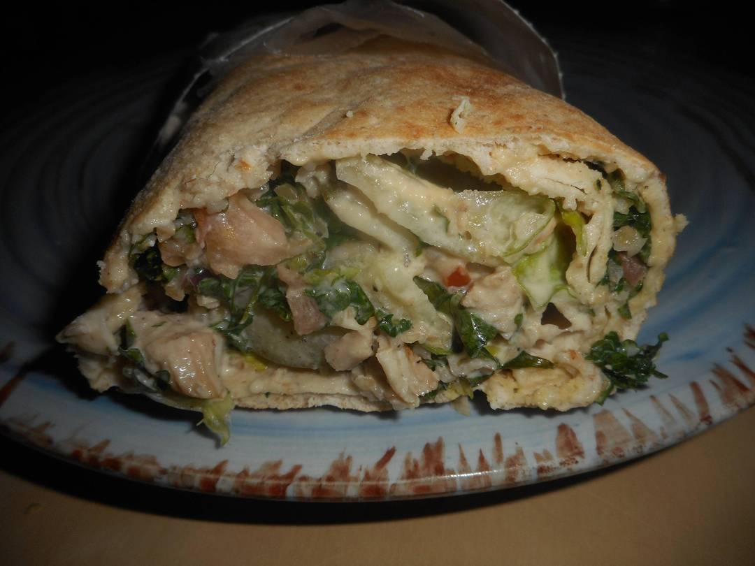 Chicken Shawarma with tomatoes, pickles, tabbouleh, hummus & garlic sauce | Scrolller
